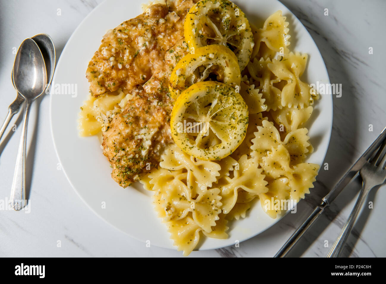 Italian American Chicken francese with farfalle pasta and side salad ...