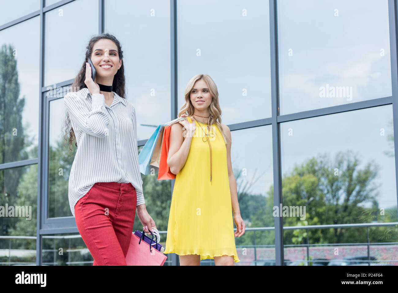 beautiful women on shopping talking by phone Stock Photo - Alamy