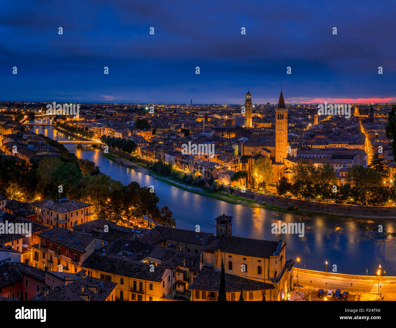 Town view of Verona at night with the church Santa Anastasia at night ...