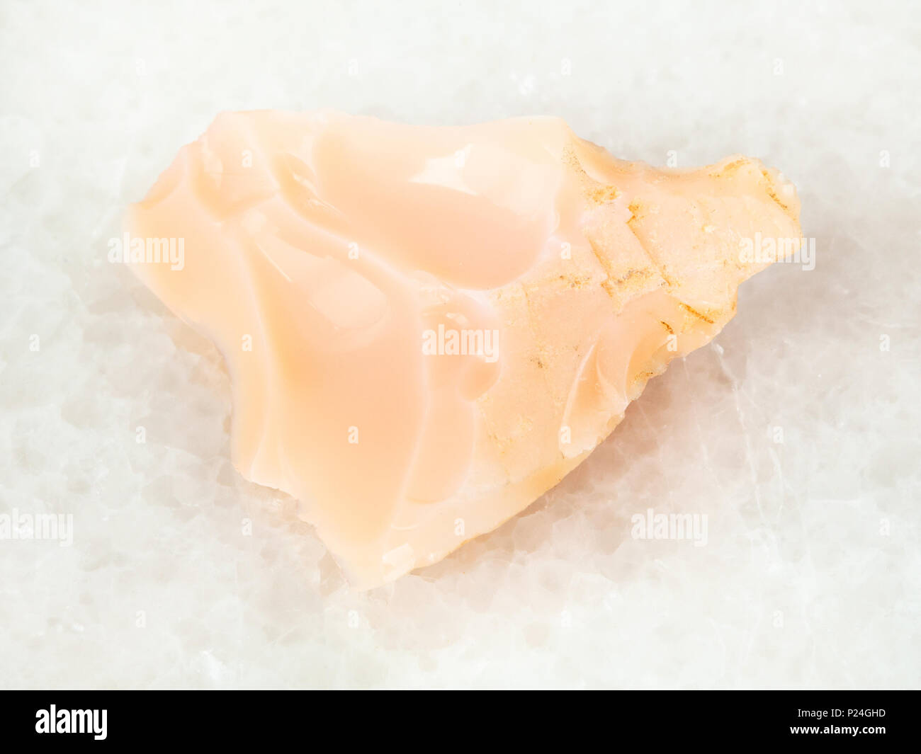 macro shooting of natural mineral - rough noble opal gemstone on white ...