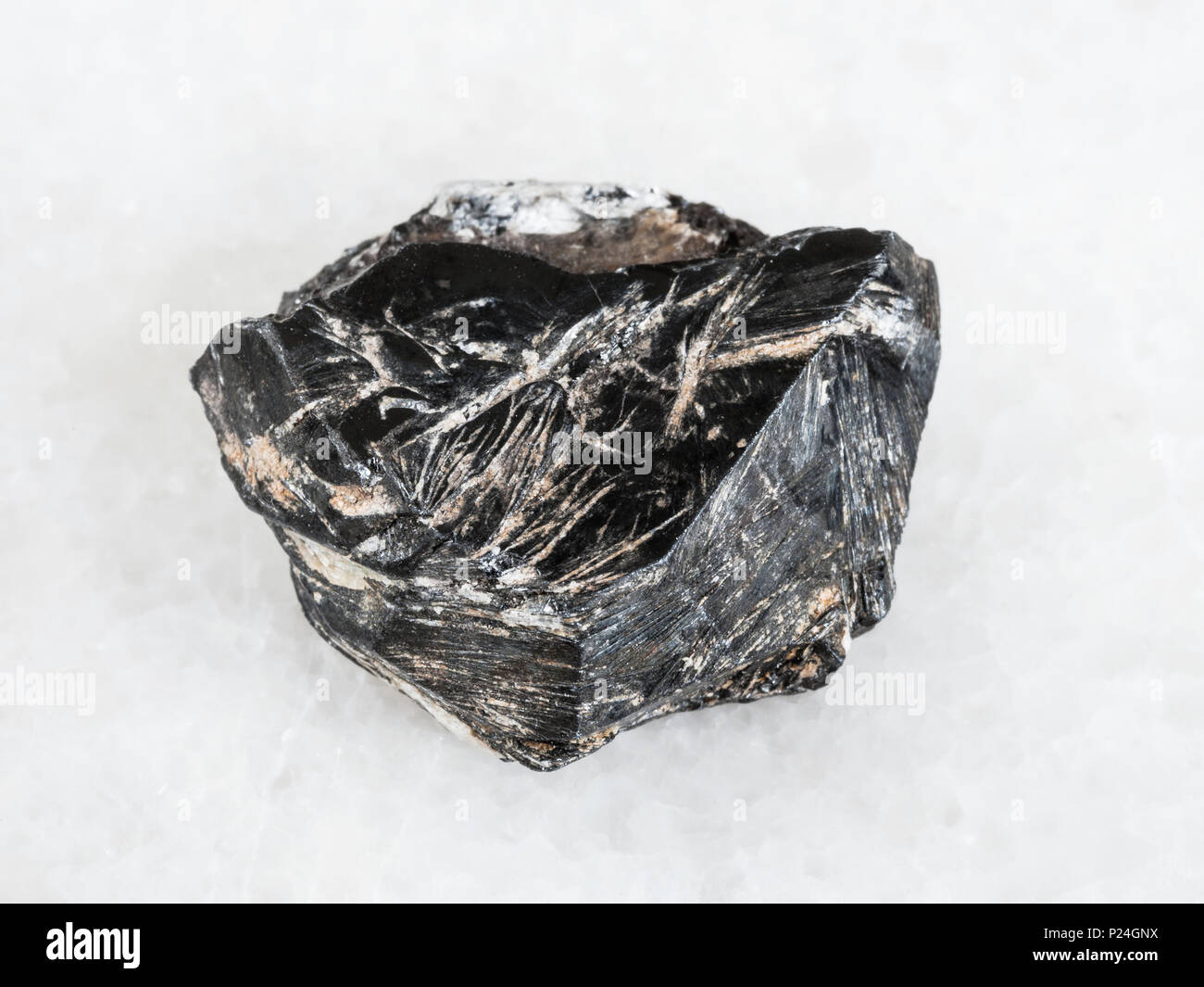 macro shooting of natural mineral - raw Hematite crystal on white ...