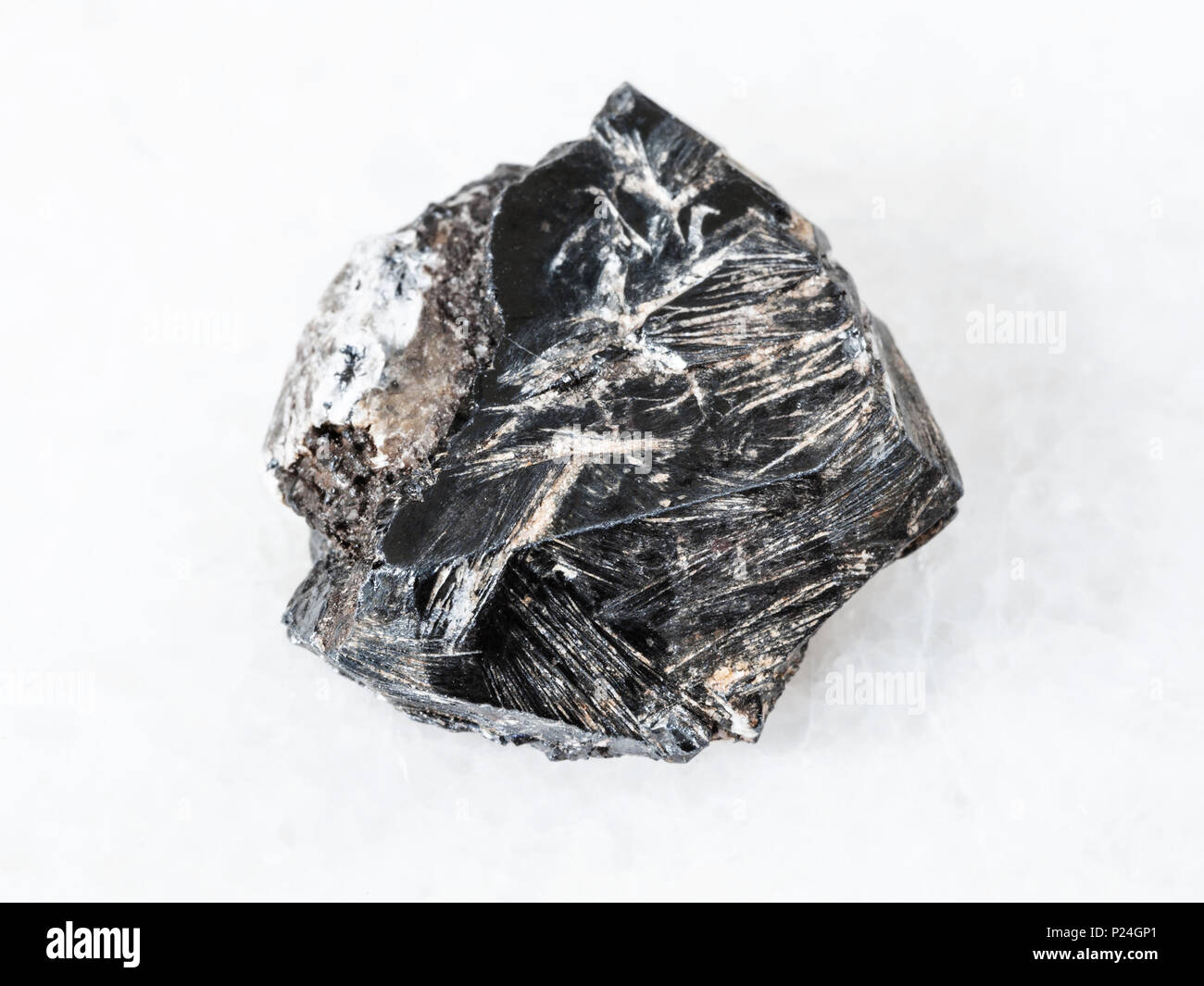macro shooting of natural mineral - Hematite crystal on white marble ...