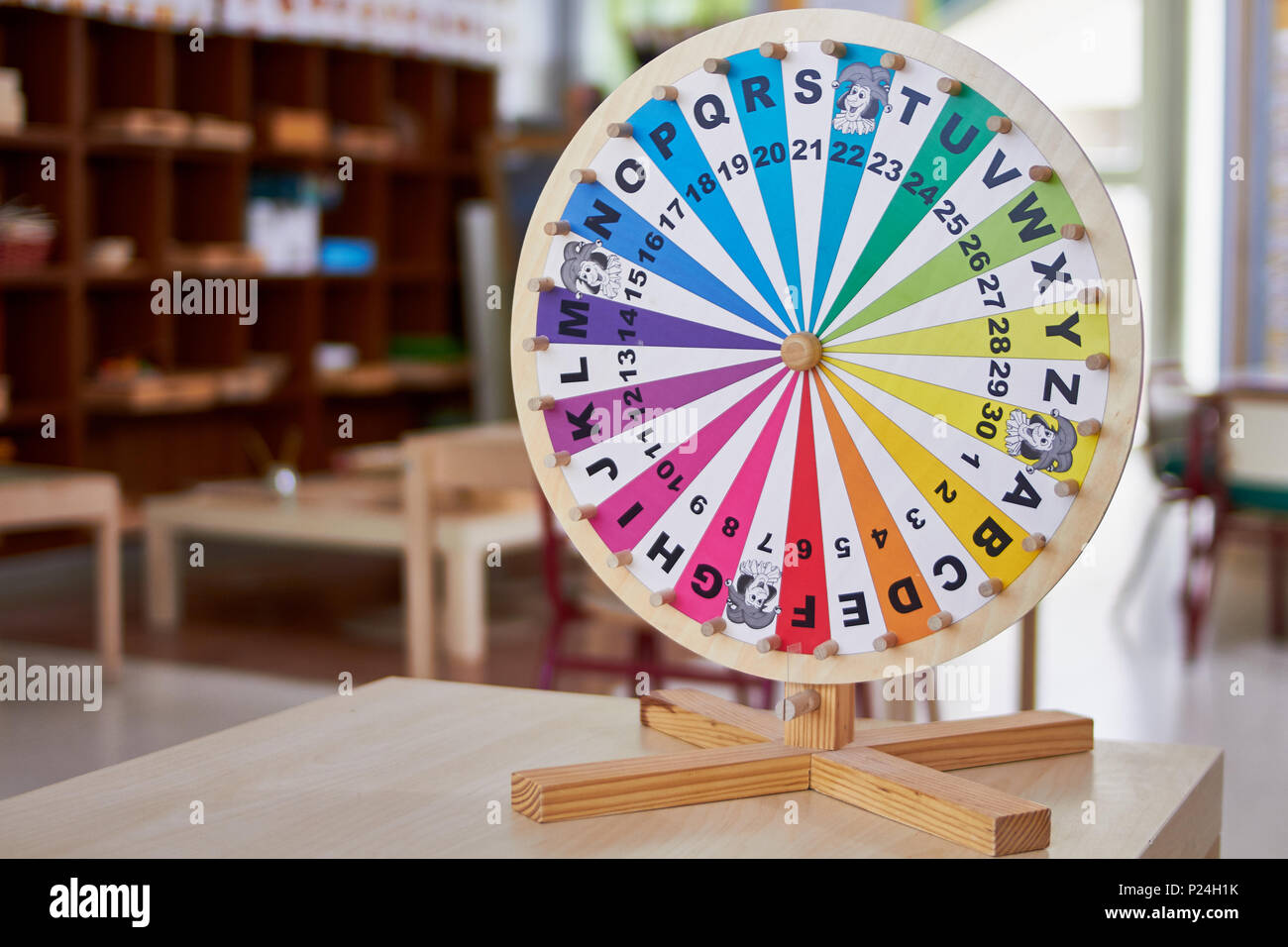 Wood wheel learning letters and numbers Stock Photo - Alamy