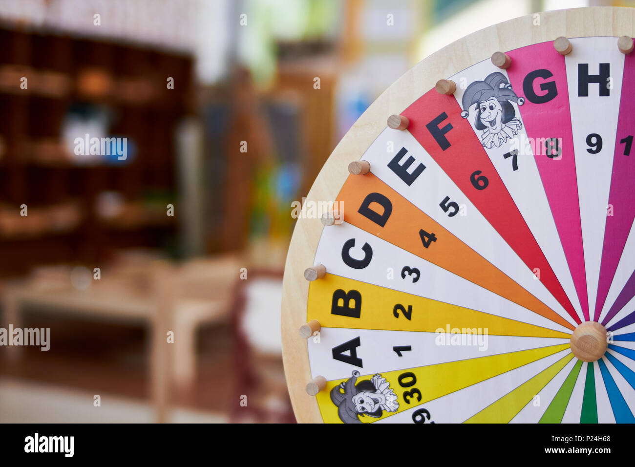 Wood wheel learning letters and numbers Stock Photo - Alamy