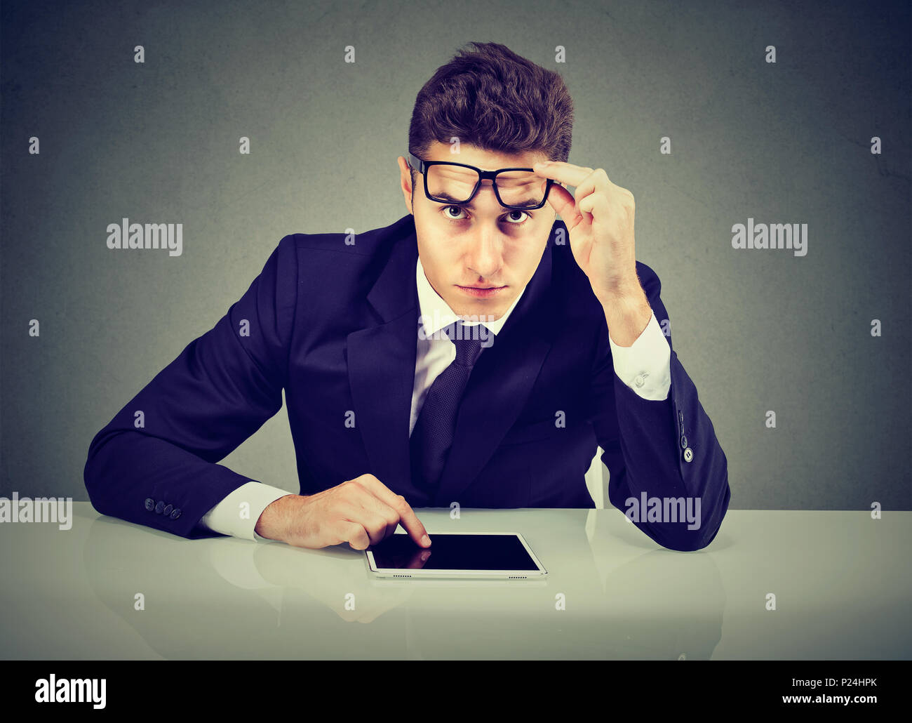 Young adult serious computer hi-res stock photography and images - Alamy
