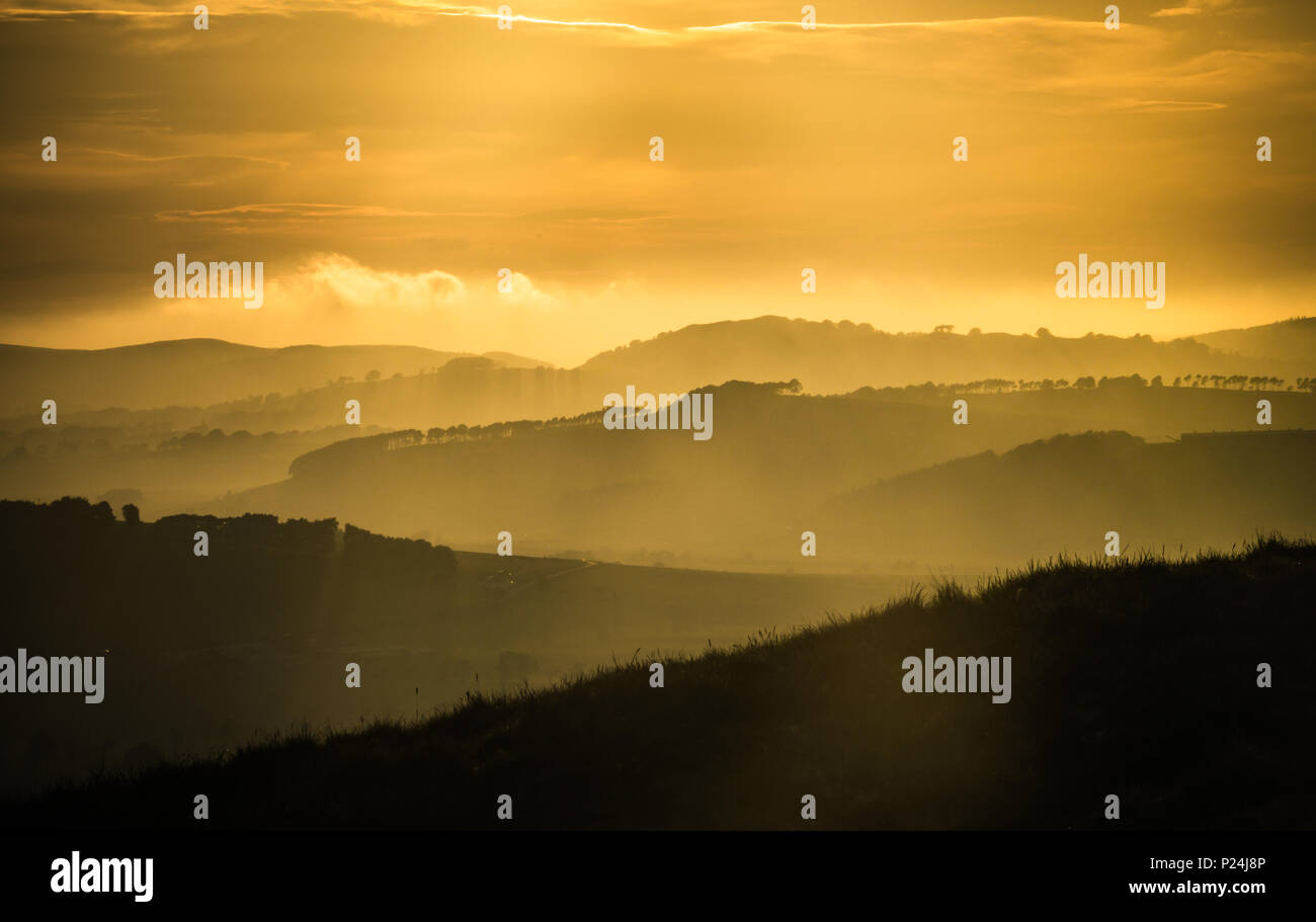 Beautiful Magic Hour Light Over Misty Rolling Hills Stock Photo - Alamy