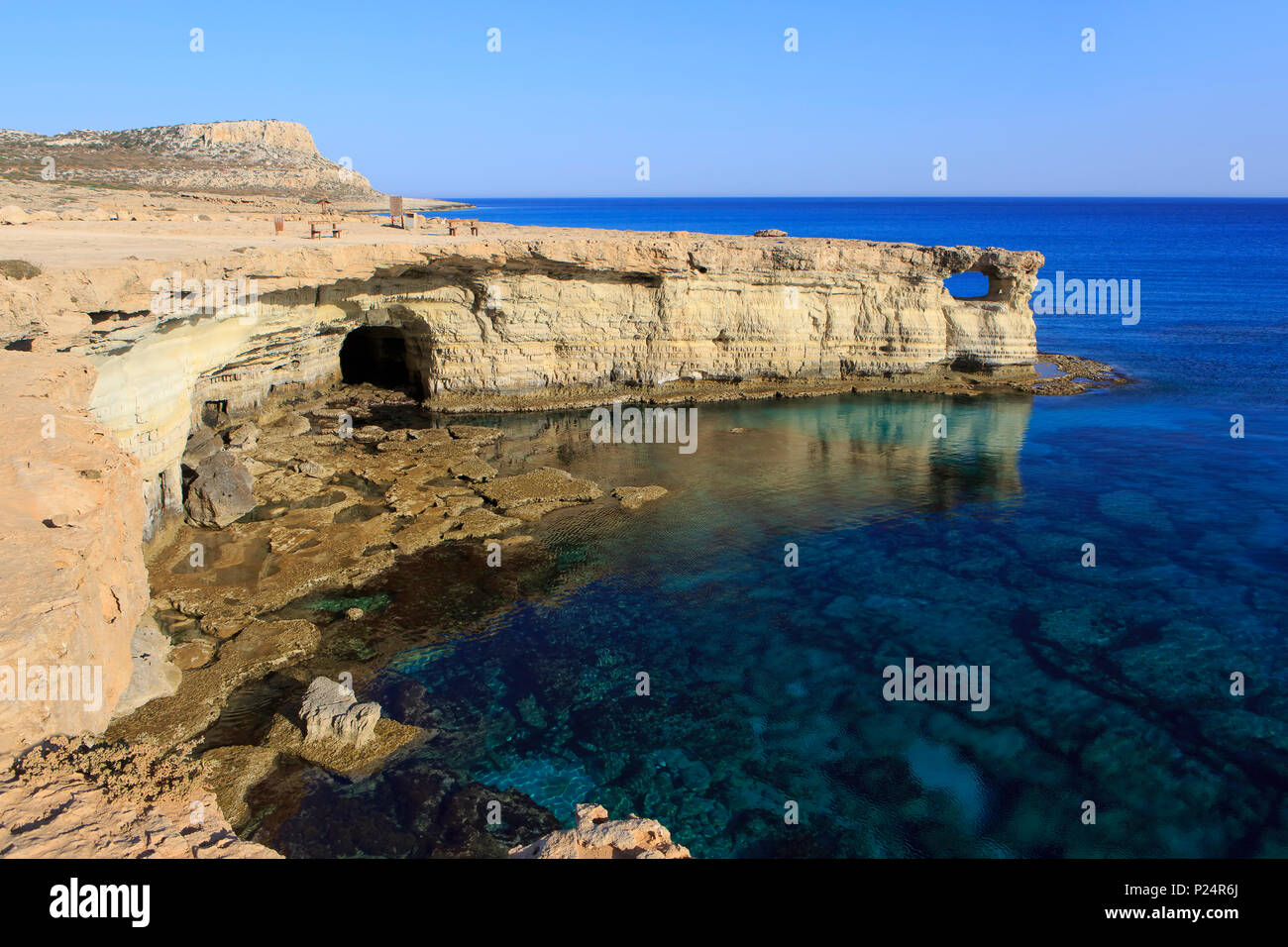 A beautiful turquoise bay surrounding the Sea Caves near Cape Greco ...