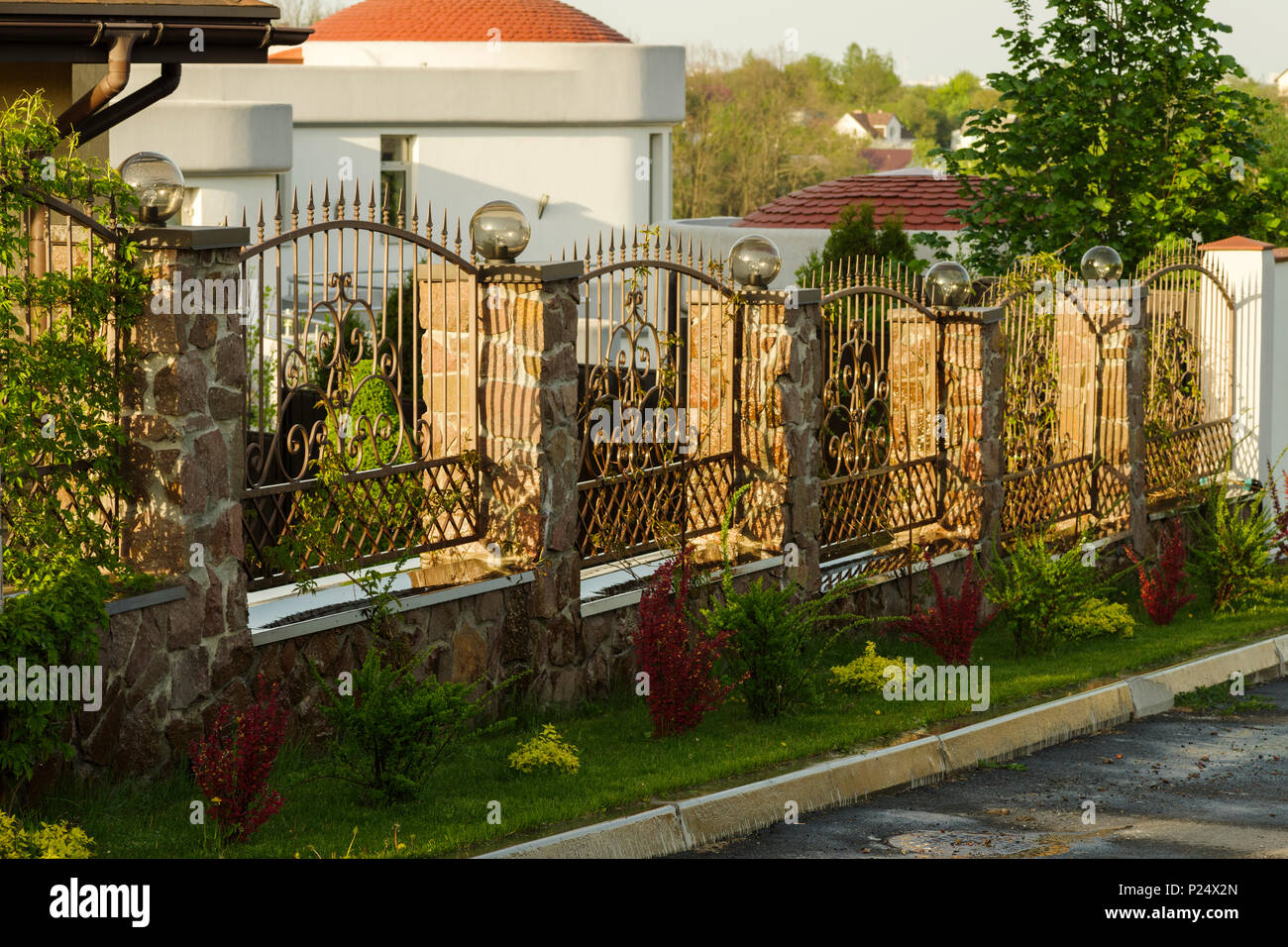 forged fence along the road Stock Photo - Alamy