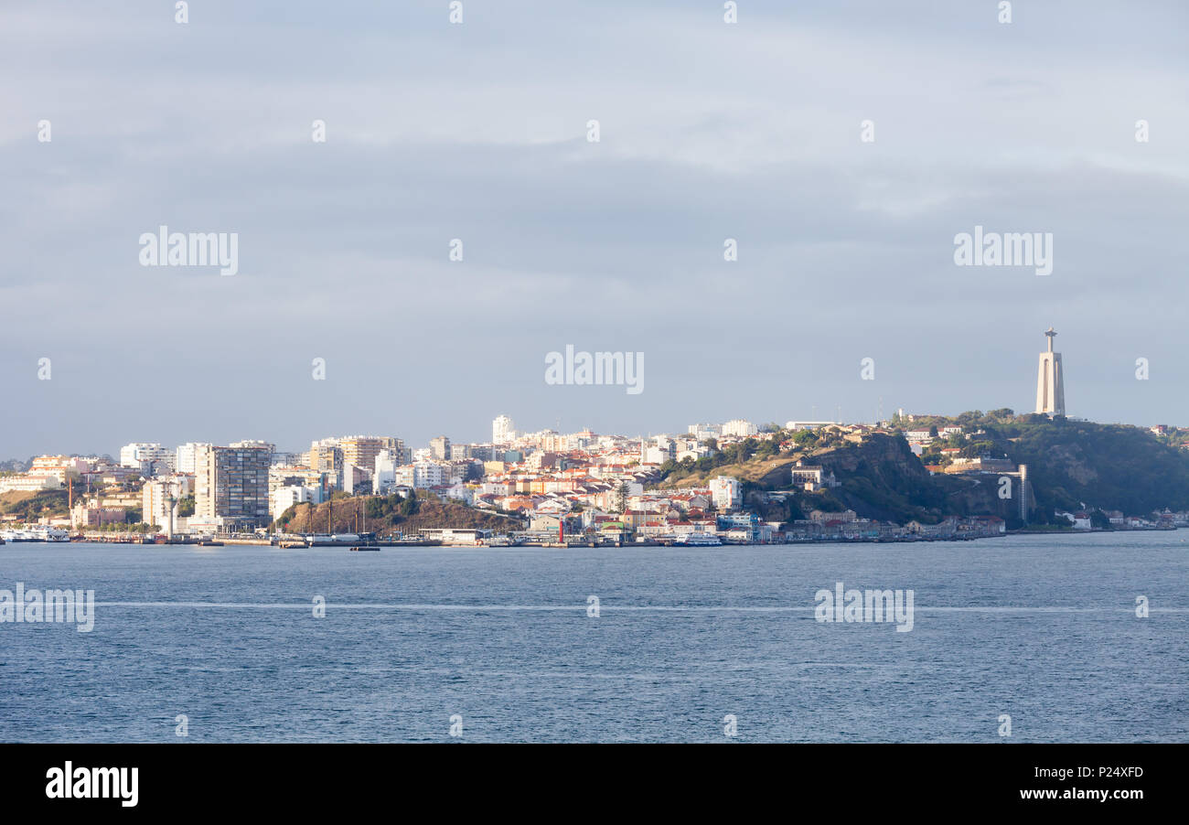 The view across the Tagus River towards the city of Almada, Portugal ...