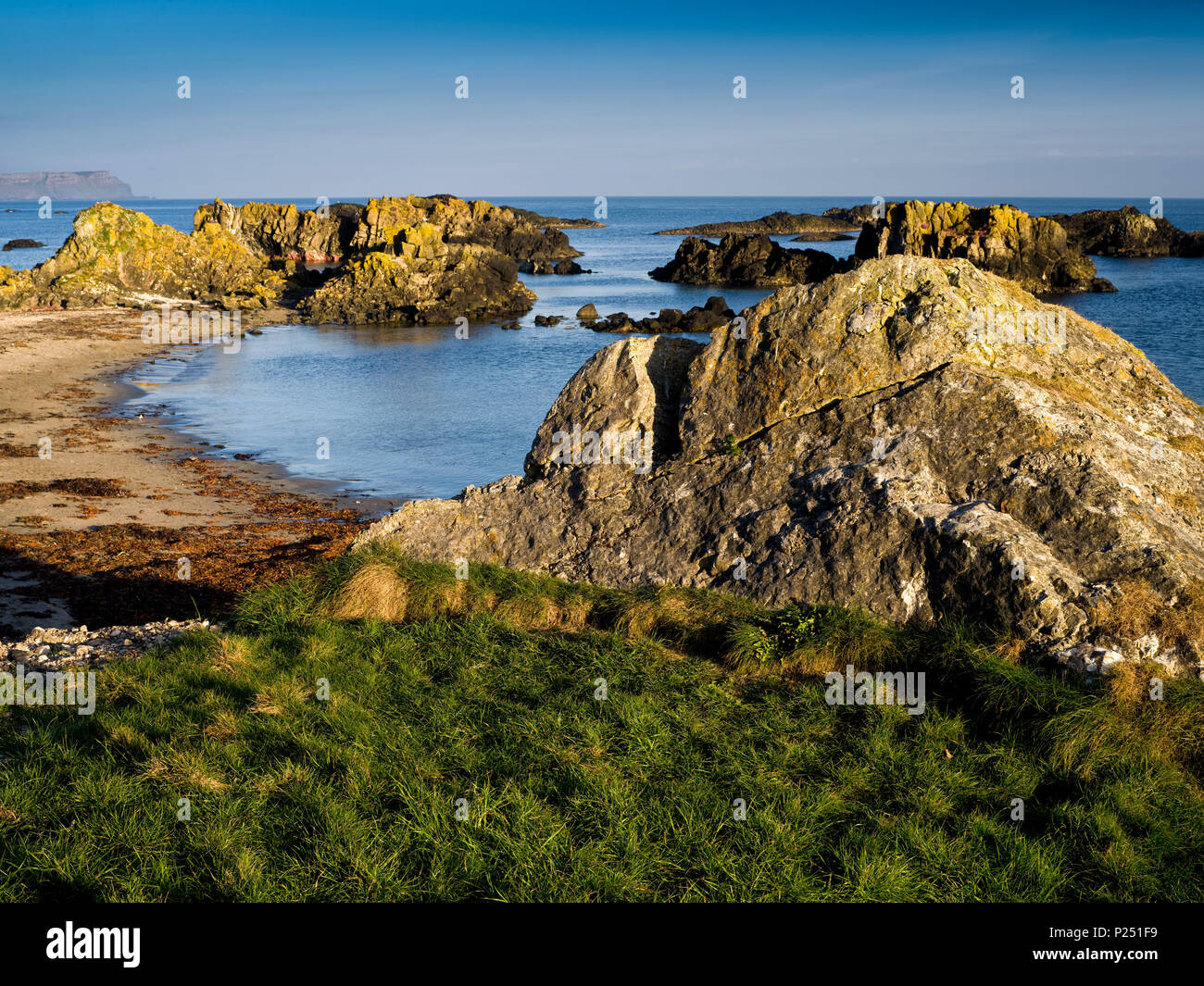 Northern Ireland, Antrim, Causeway Coast, sandy beach with basalt and ...