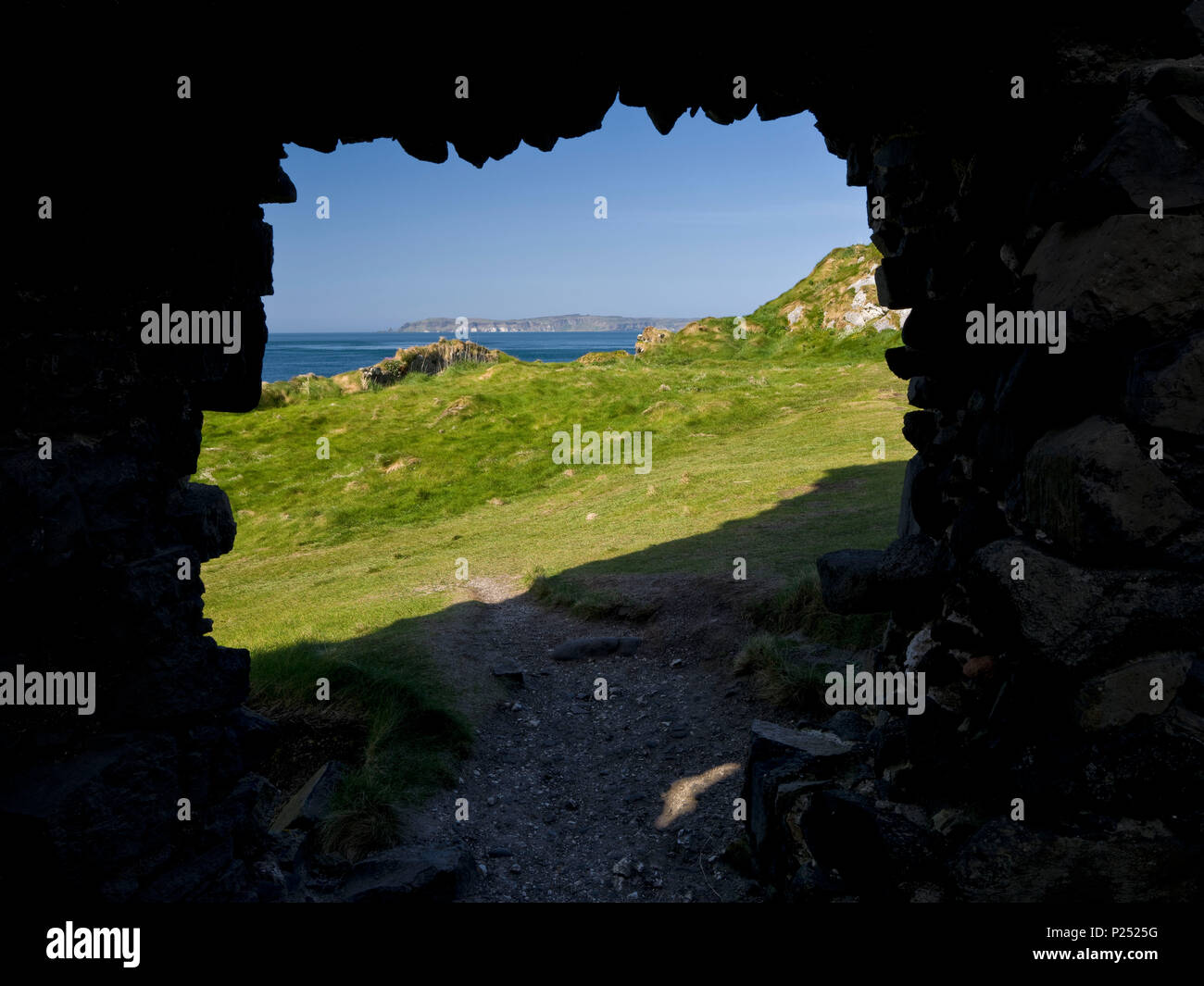 Northern Ireland, Antrim, Causeway Coast, view through a window of a ...