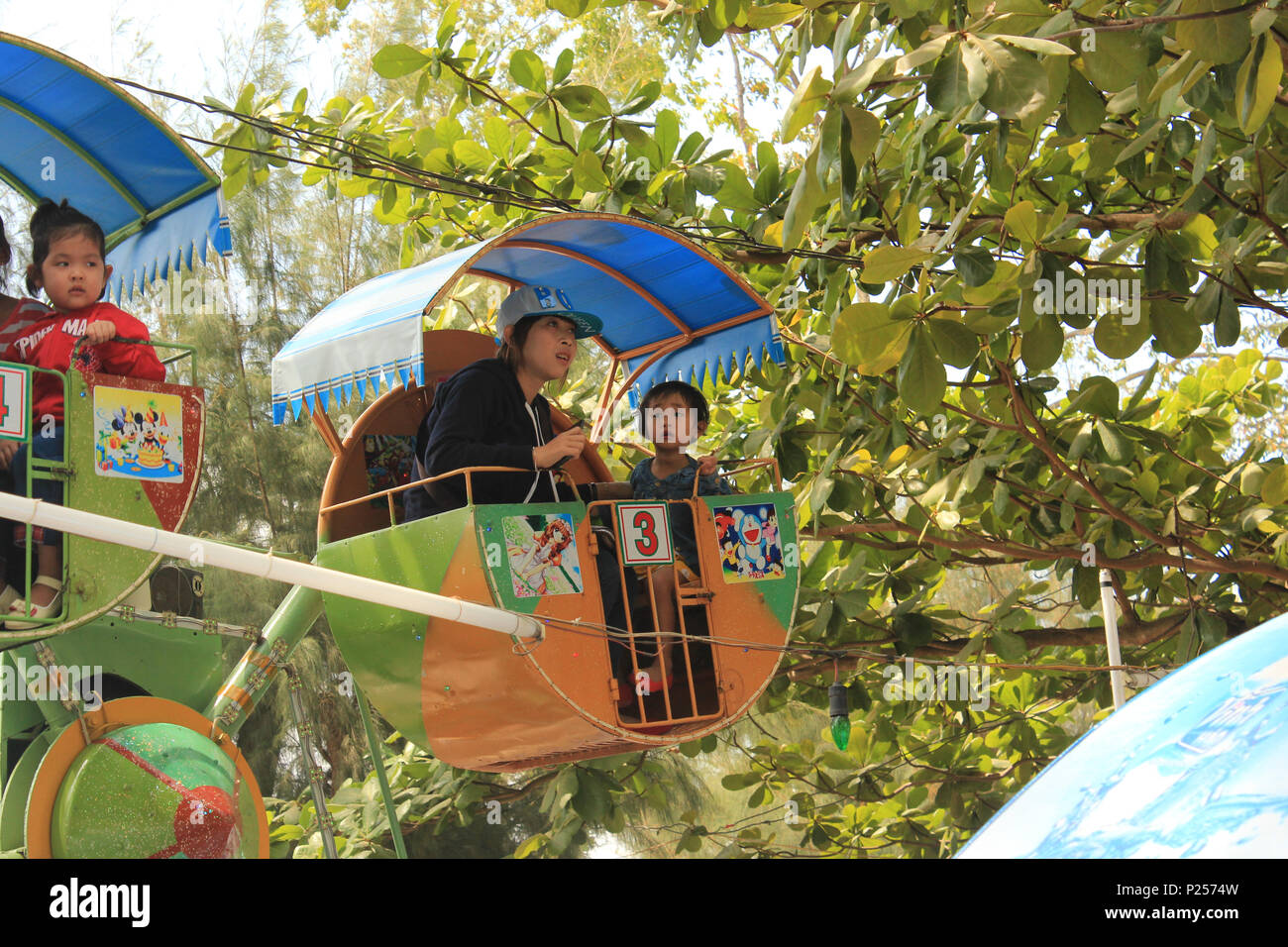 Phan Thiet , Vietnam - January 2014: People and children at amusement ...