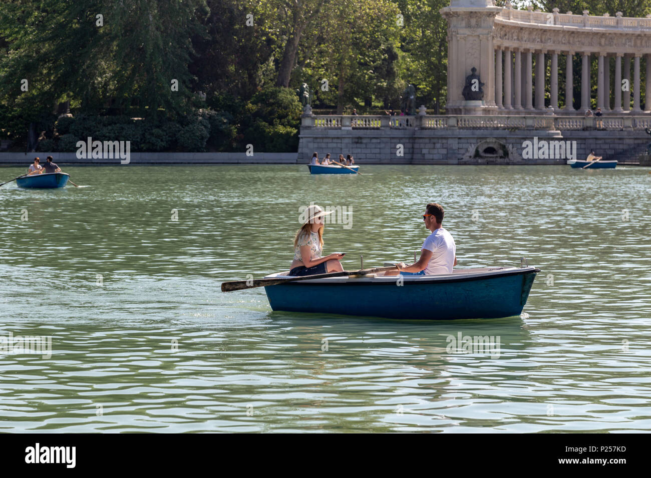 Couple on a boat in the lake of El Retiro Park, Madrid, Spain Stock ...