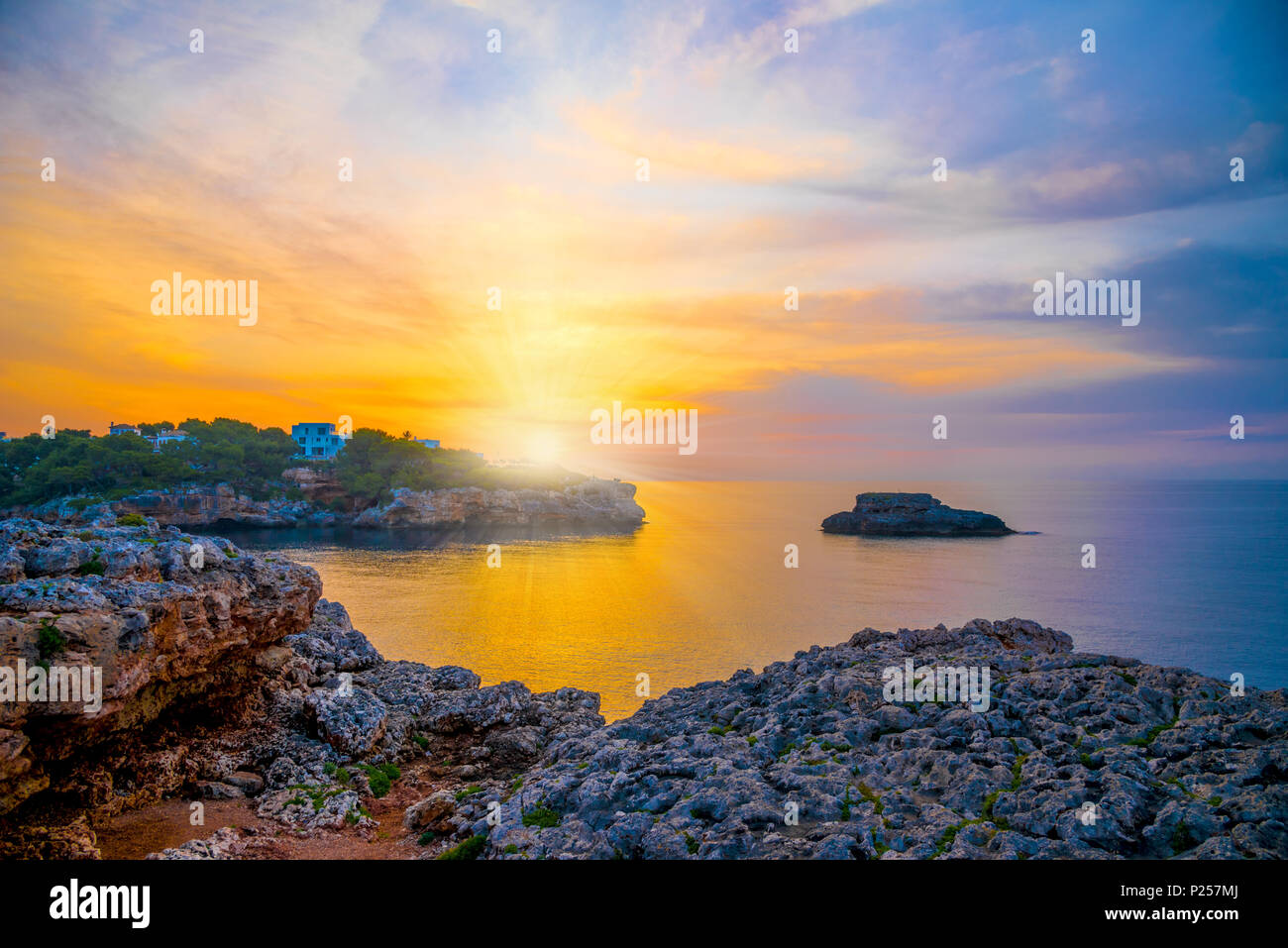 Amazing colorful sunrise scene over Punta Grossa coastline in Mallorca ...