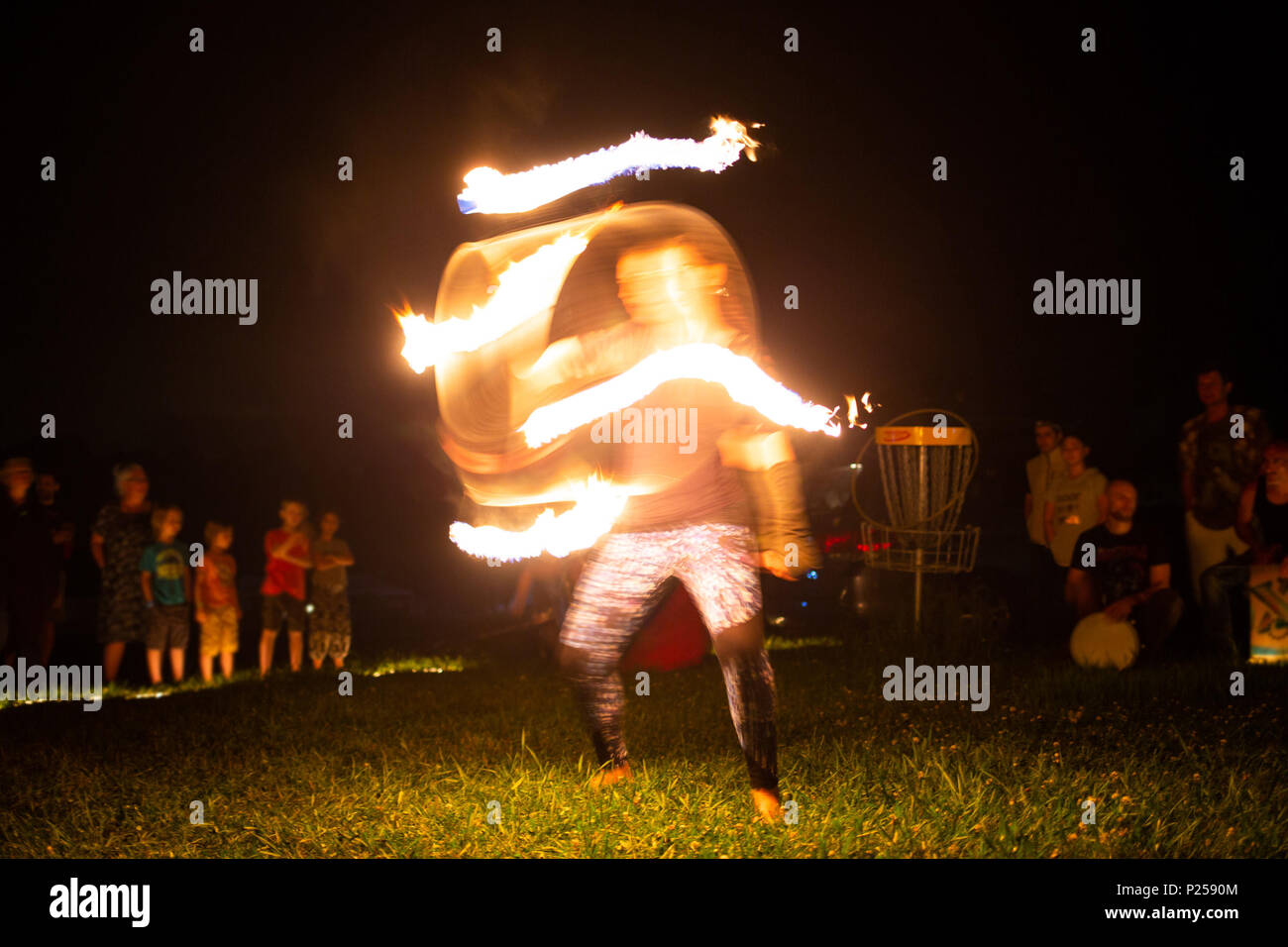 Beautiful solo fire show performance at night Stock Photo - Alamy