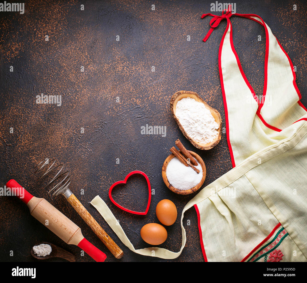 Ingredients for baking and apron Stock Photo - Alamy