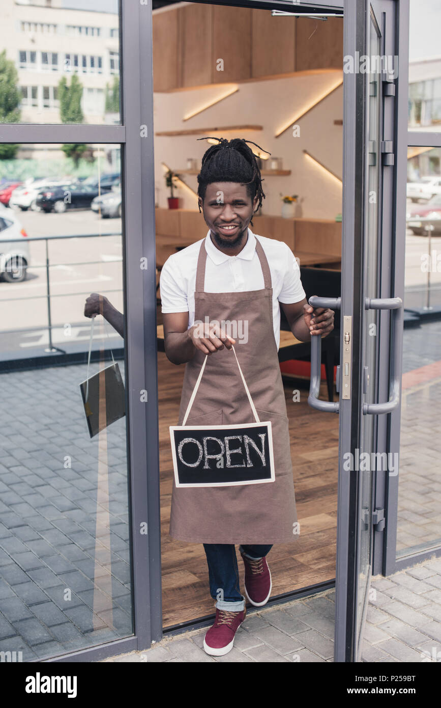 smiling african american coffee shop owner with open sign Stock Photo ...