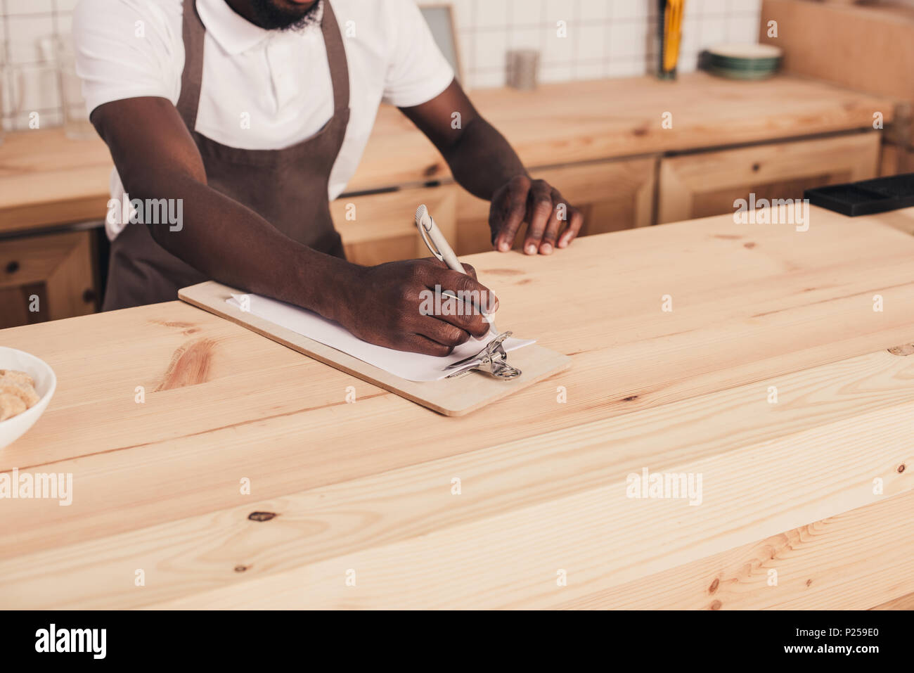 Man worker counter taking order hi-res stock photography and images - Alamy