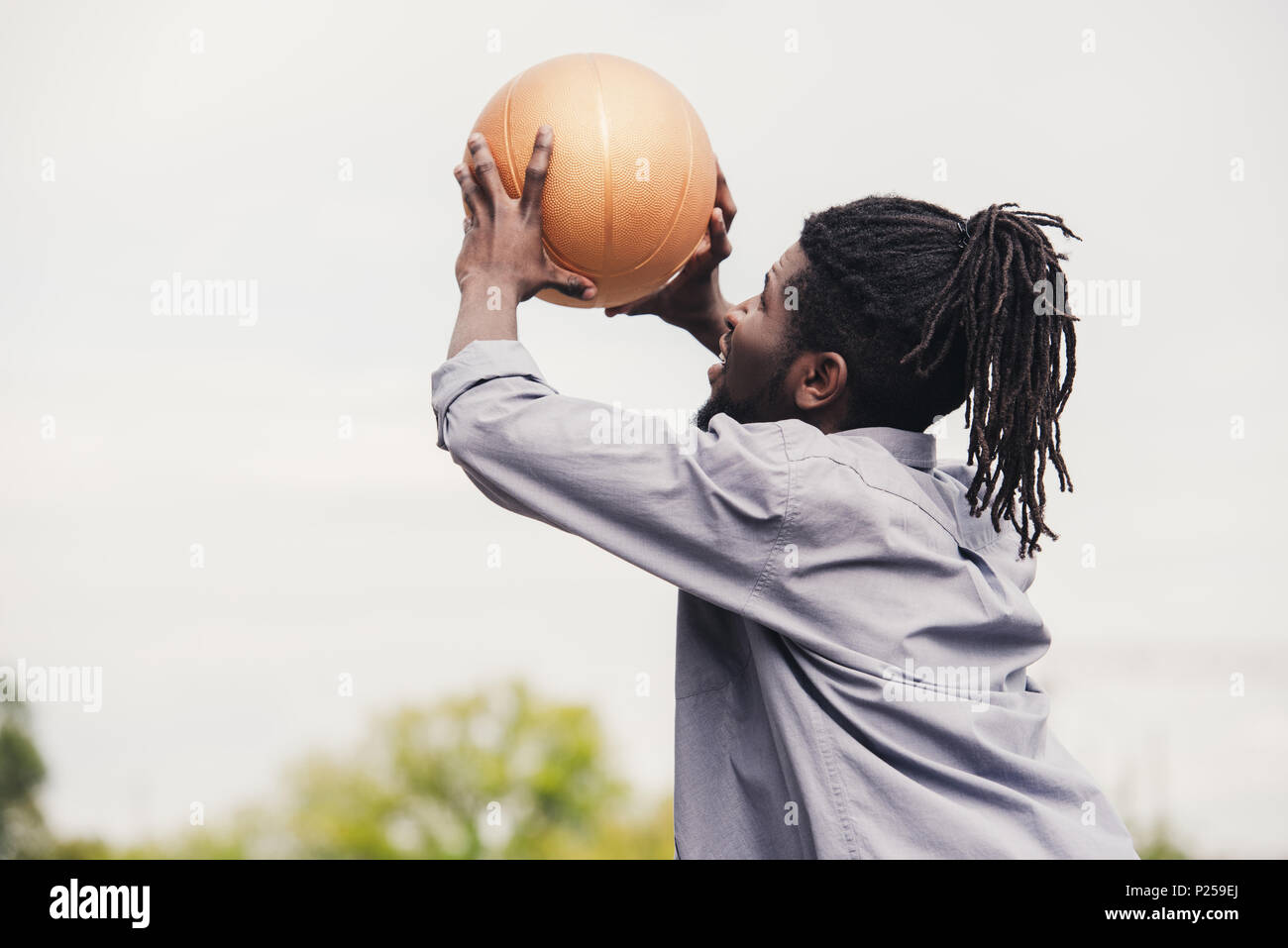 african american man training and throwing basketball ball Stock Photo ...