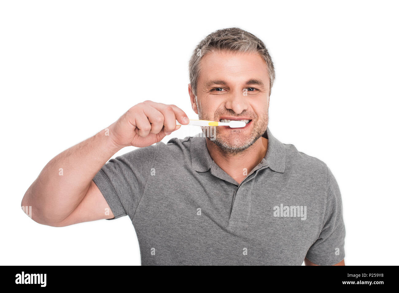 man brushing teeth with tooth brush, isolated on white Stock Photo - Alamy