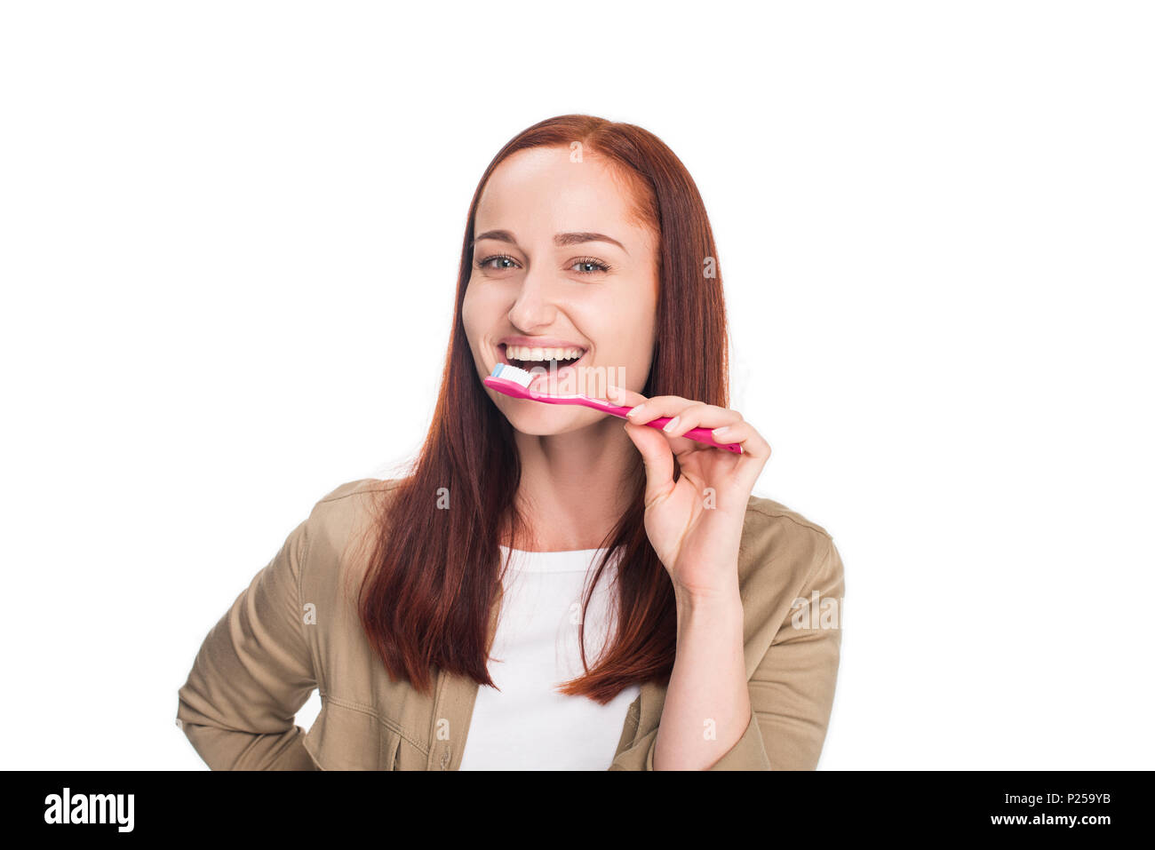 young smiling woman brushing teeth with tooth brush, isolated on white ...