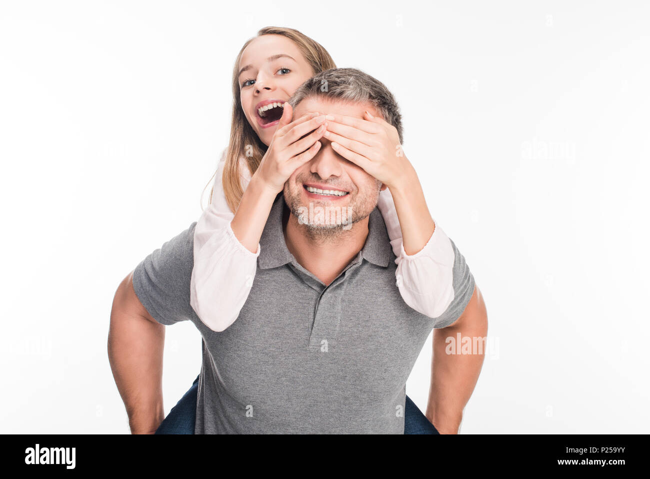 happy father piggybacking daughter while she closing his eyes, isolated ...