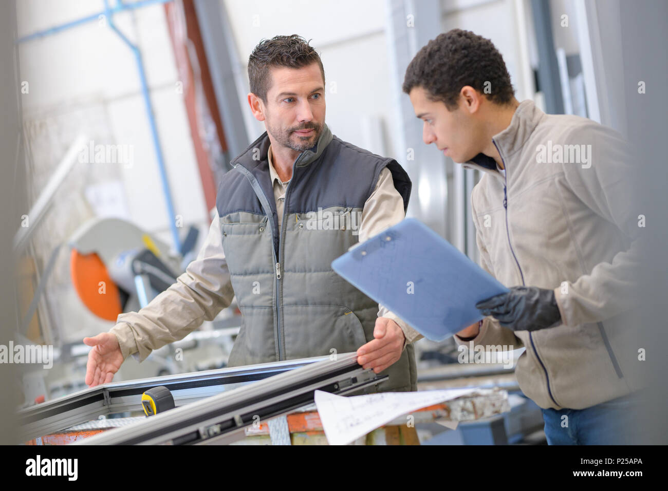 workers assembling pvc doors and windows at a factory Stock Photo - Alamy