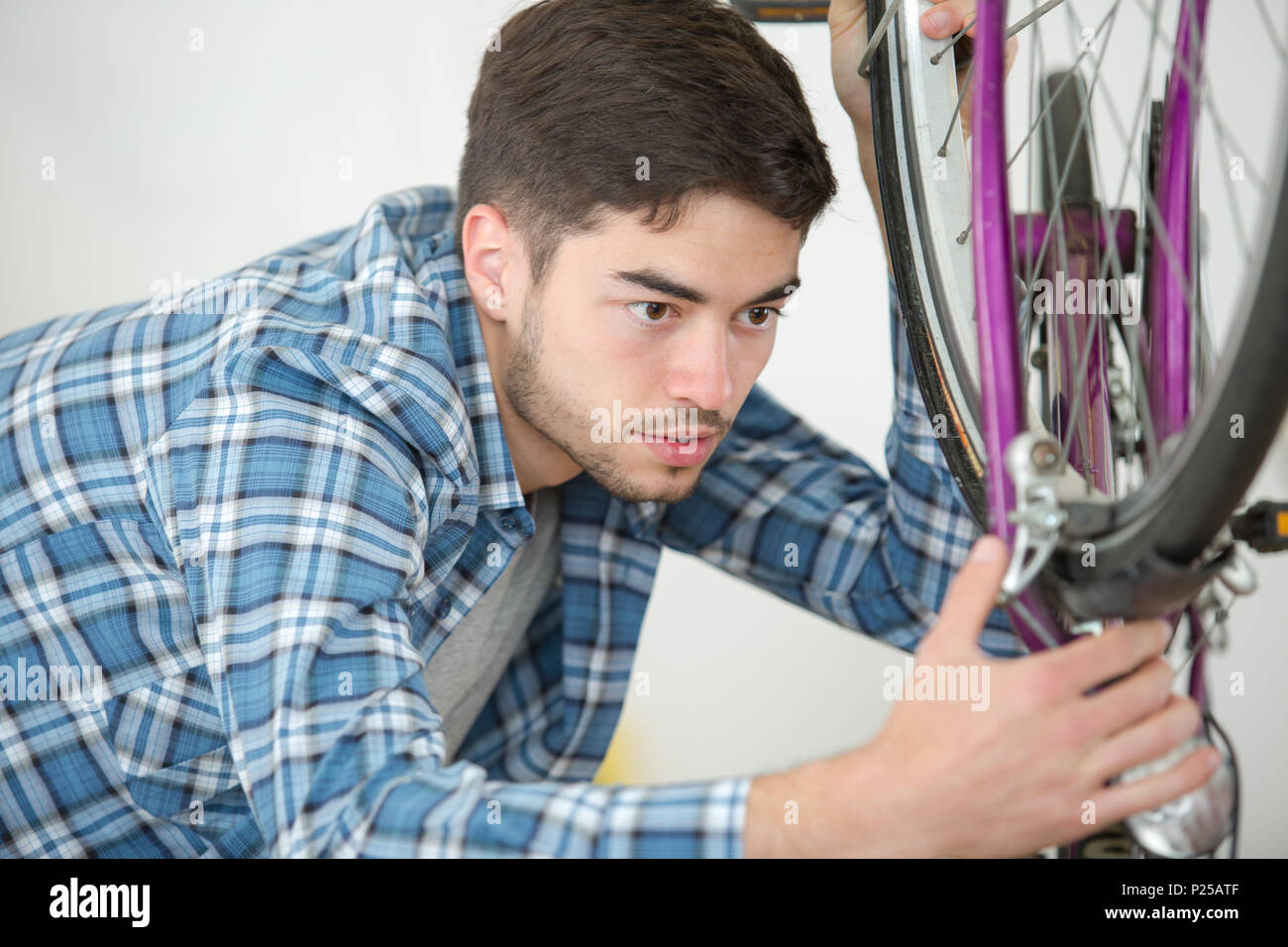man fixing chainring on a bicycle Stock Photo - Alamy