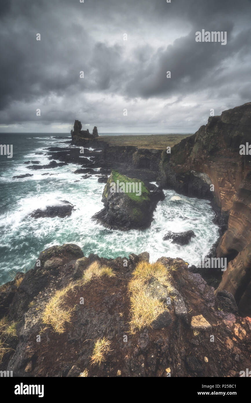 Bird rock and the sorrounding basalt cliffs. Londrangar, Snaefellsness ...