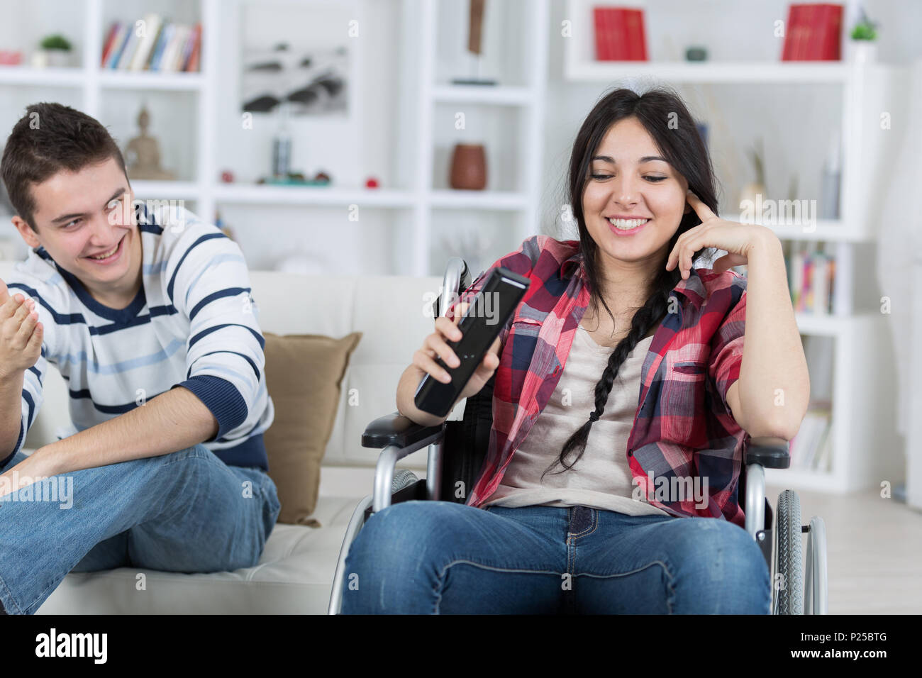 Disabled teenager listening to music Stock Photo - Alamy