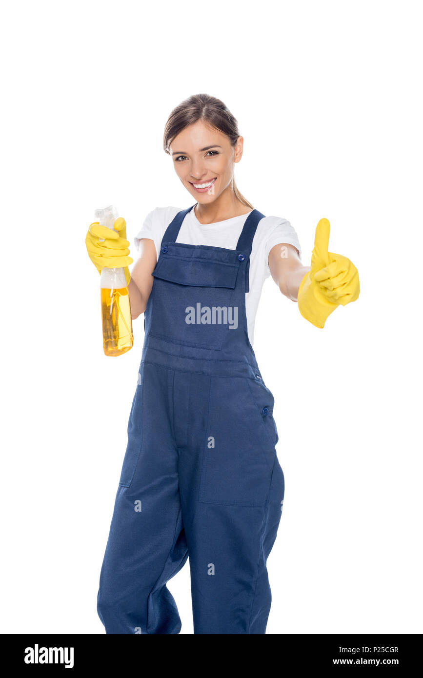 portrait of smiling cleaner with cleanser in hand showing thumb up ...