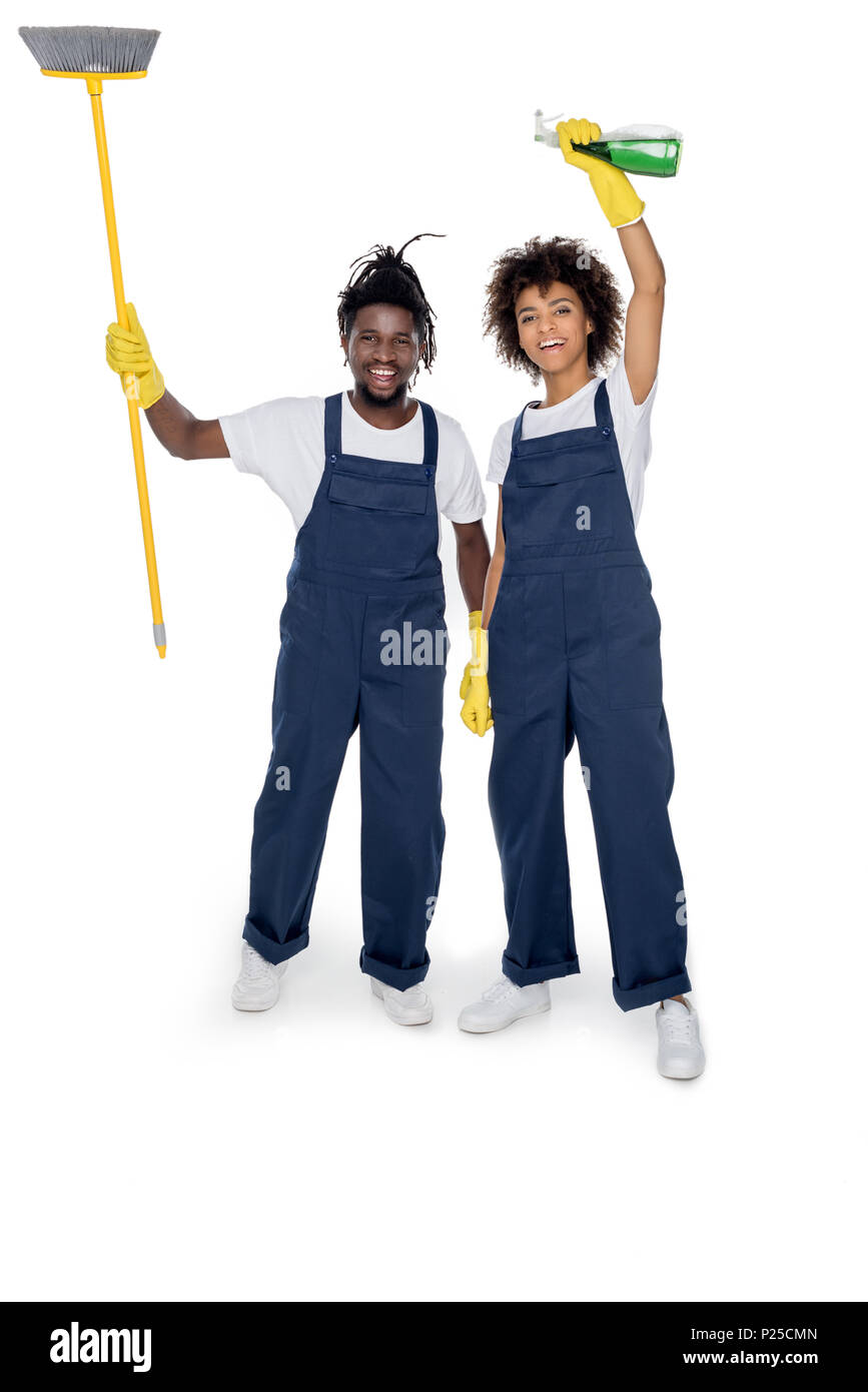 excited african american cleaners with broom and detergent isolated on ...