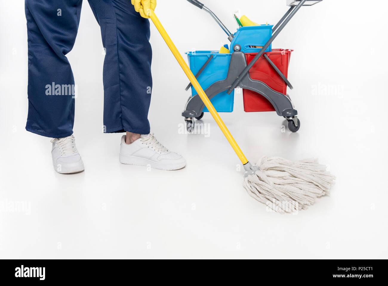 partial view of cleaner mopping floor with mop isolated on white Stock ...