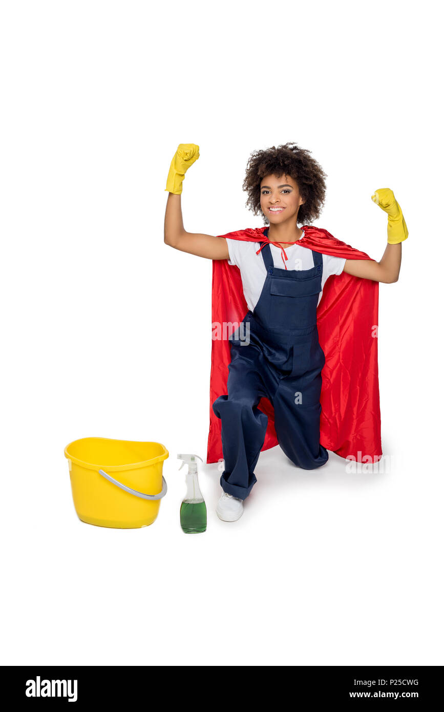 cheerful african american cleaner in uniform showing muscles isolated ...