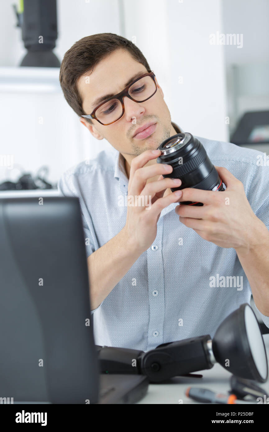 photographer checking the lens Stock Photo - Alamy