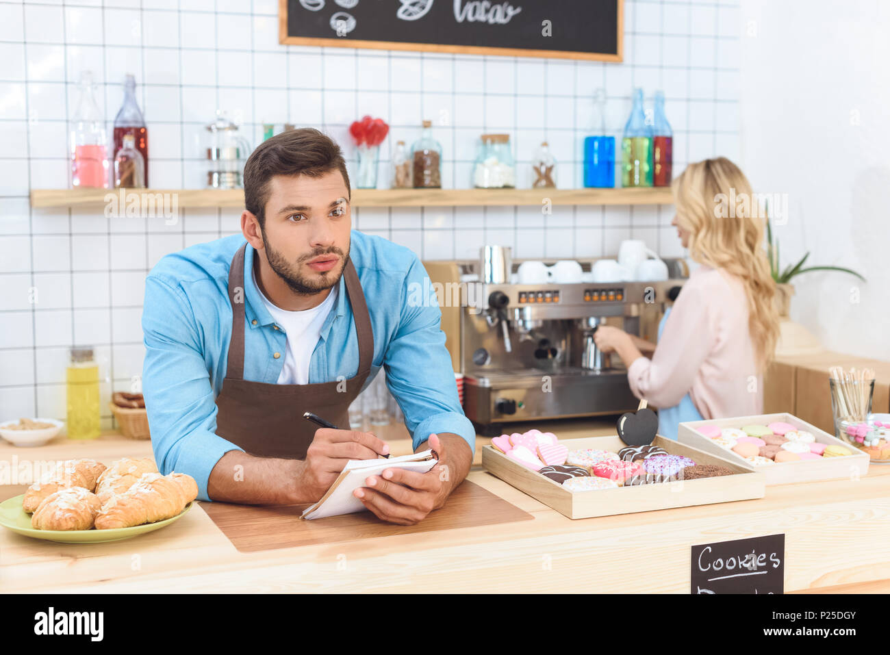 Pretty barista taking notes hi-res stock photography and images - Alamy