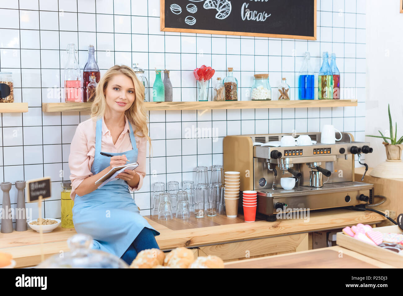 Pretty barista taking notes hi-res stock photography and images - Alamy