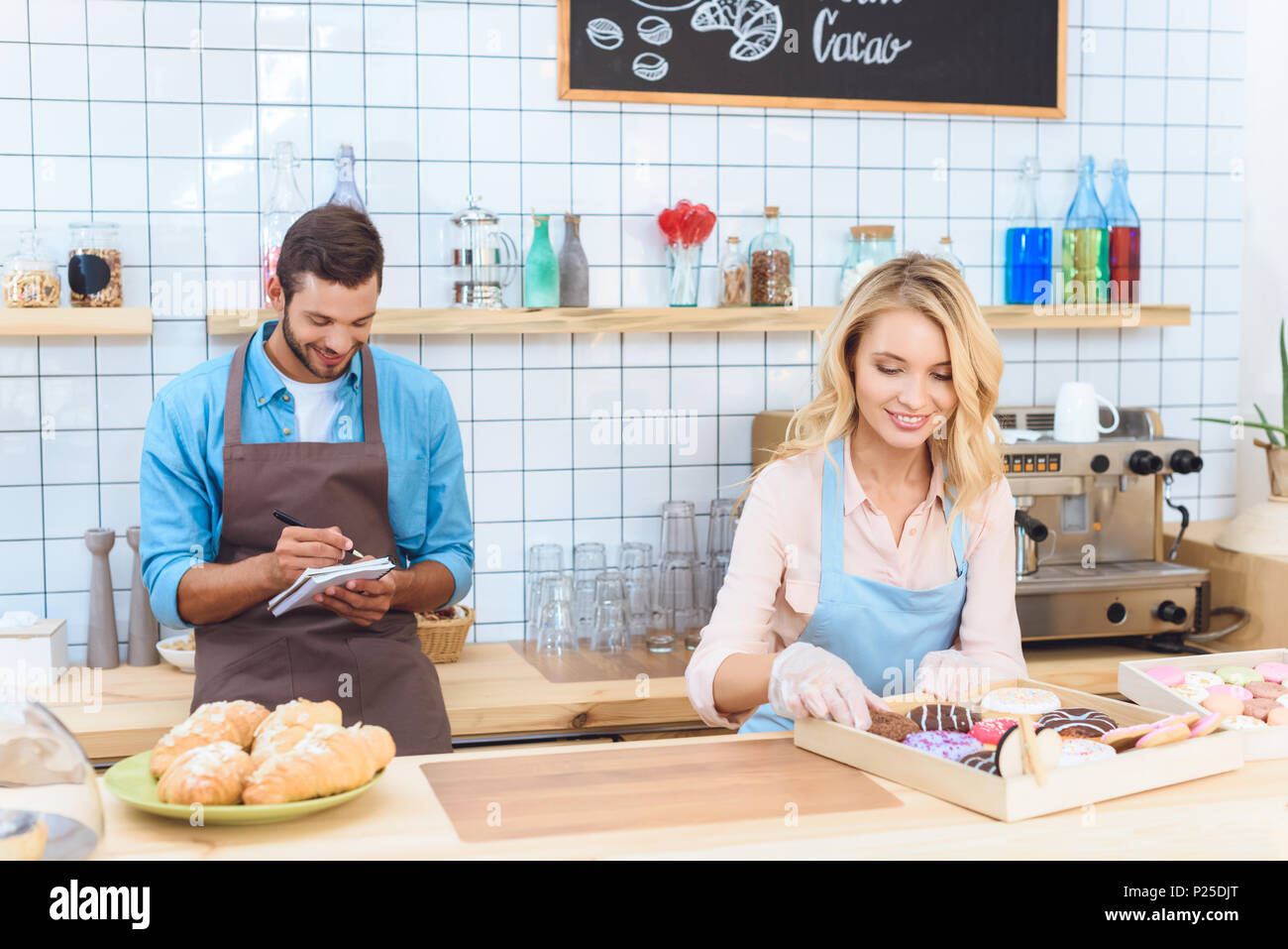 Pretty barista taking notes hi-res stock photography and images - Alamy