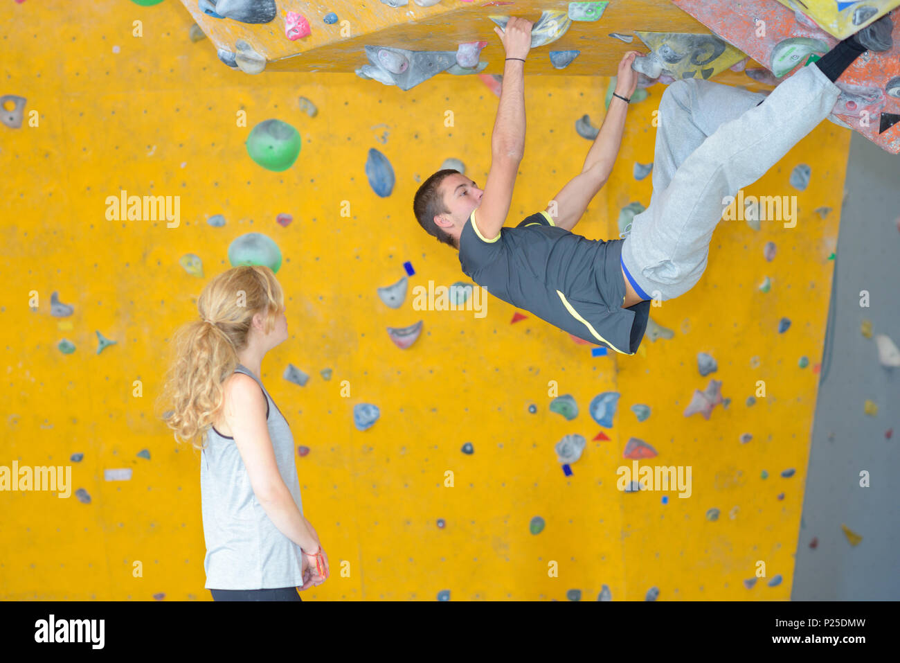 Man scaling climbing wall hi-res stock photography and images - Alamy