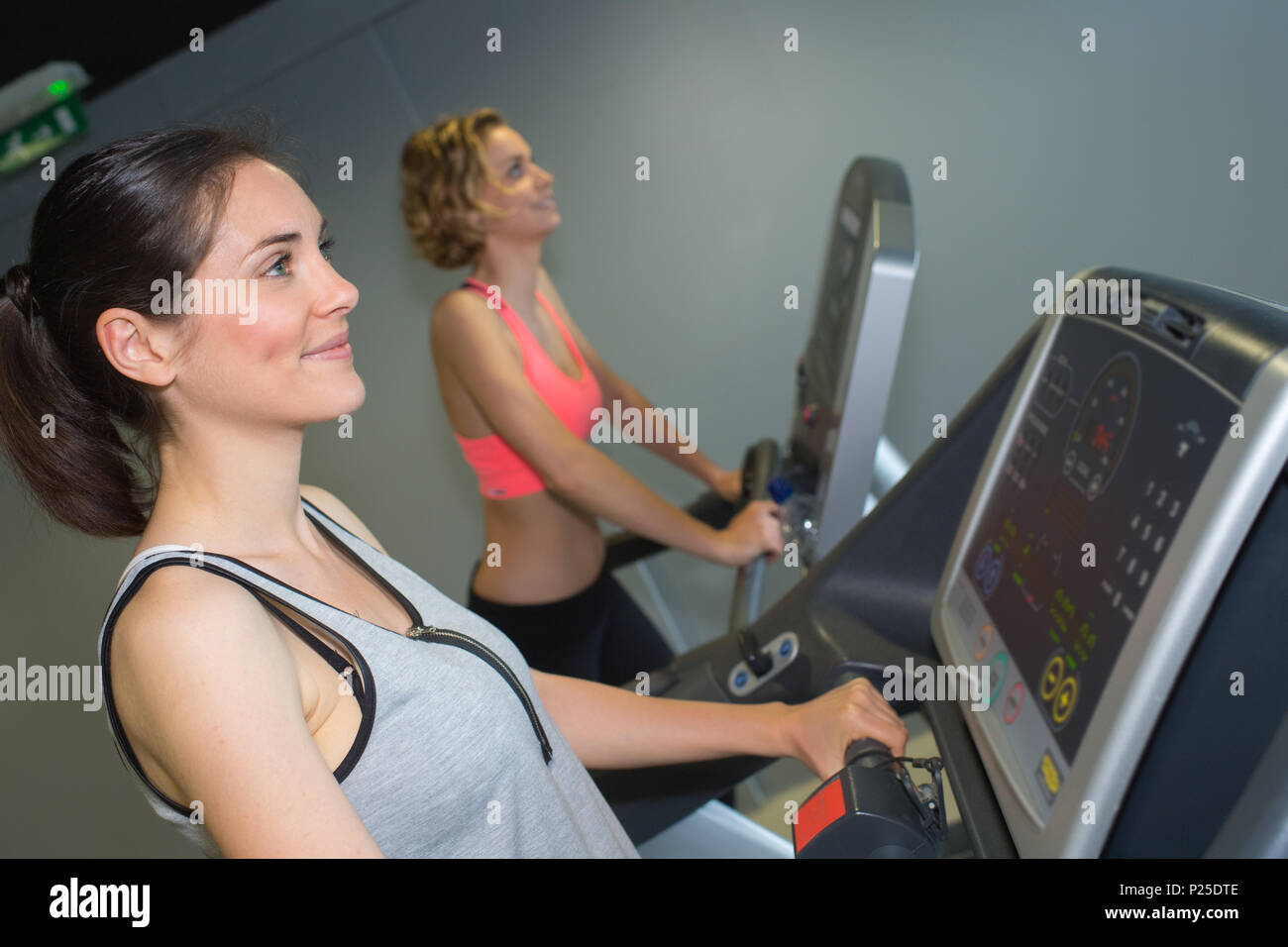 women doing exercises on the machines in the gym Stock Photo - Alamy
