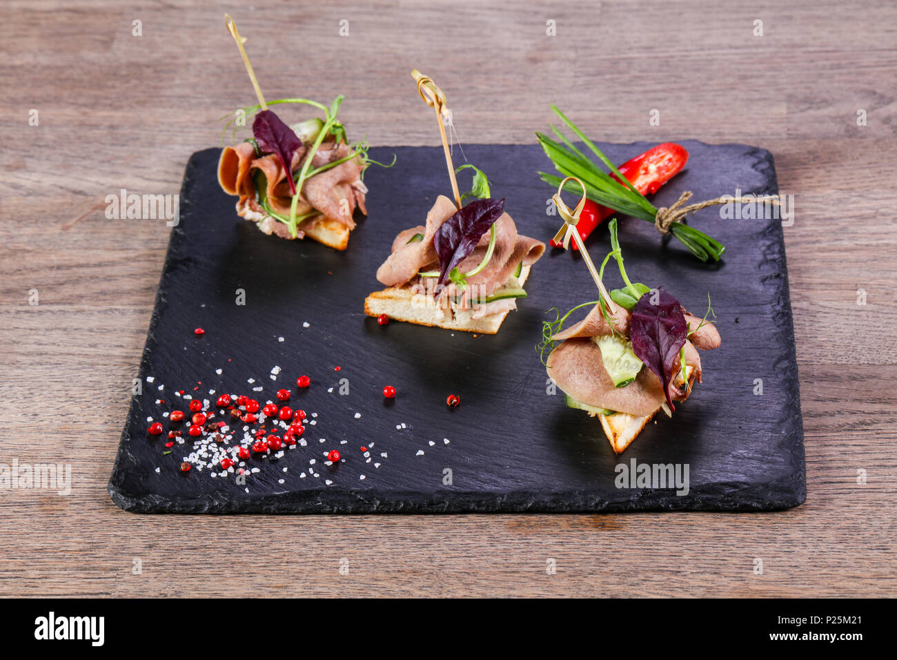 Beef canape served green onion Stock Photo - Alamy
