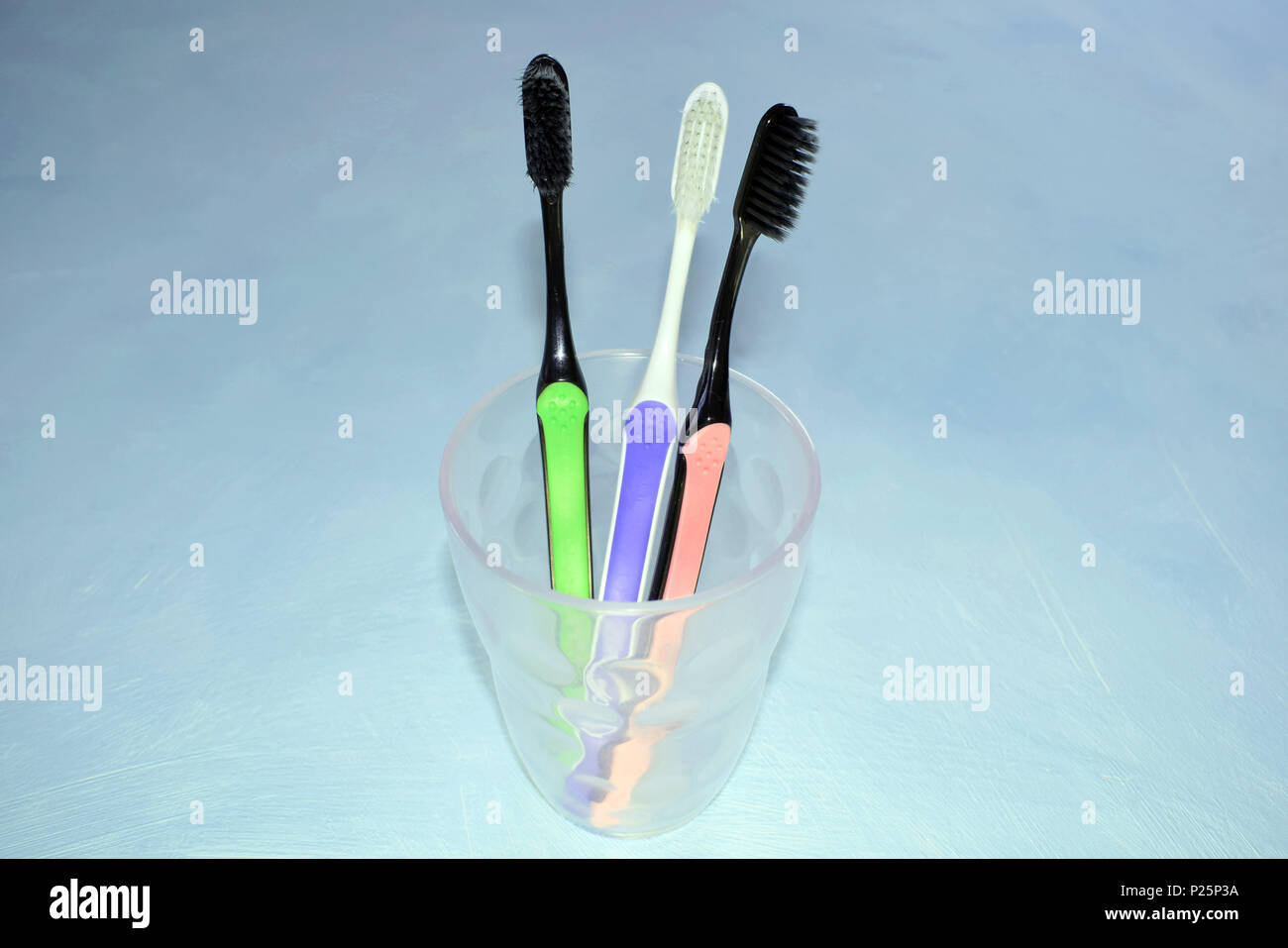 Toothbrush and toothpaste in cup hi-res stock photography and images ...