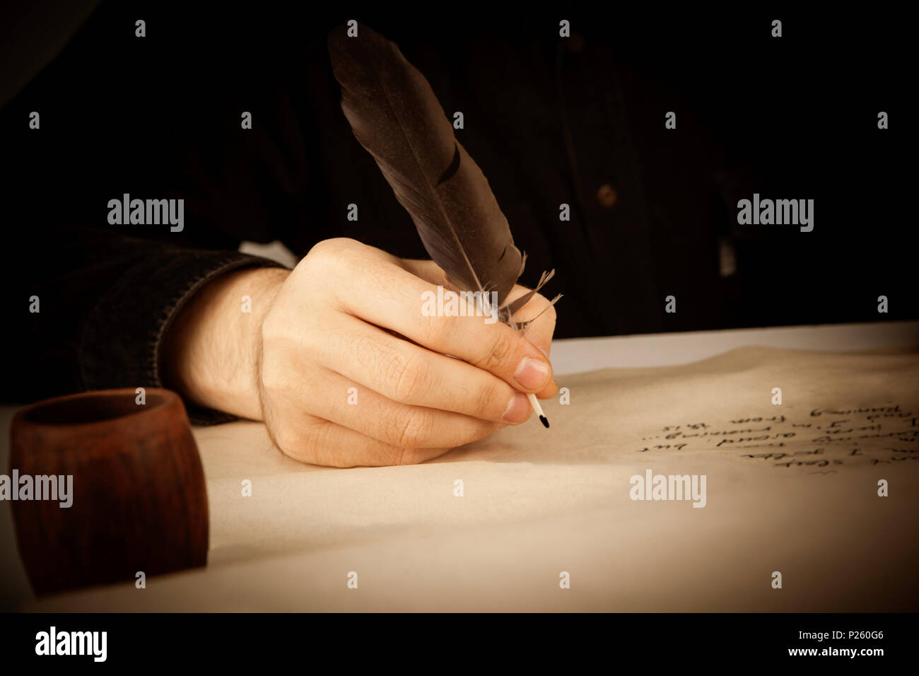 writer holds a fountain pen over writing paper and the writing poems ...