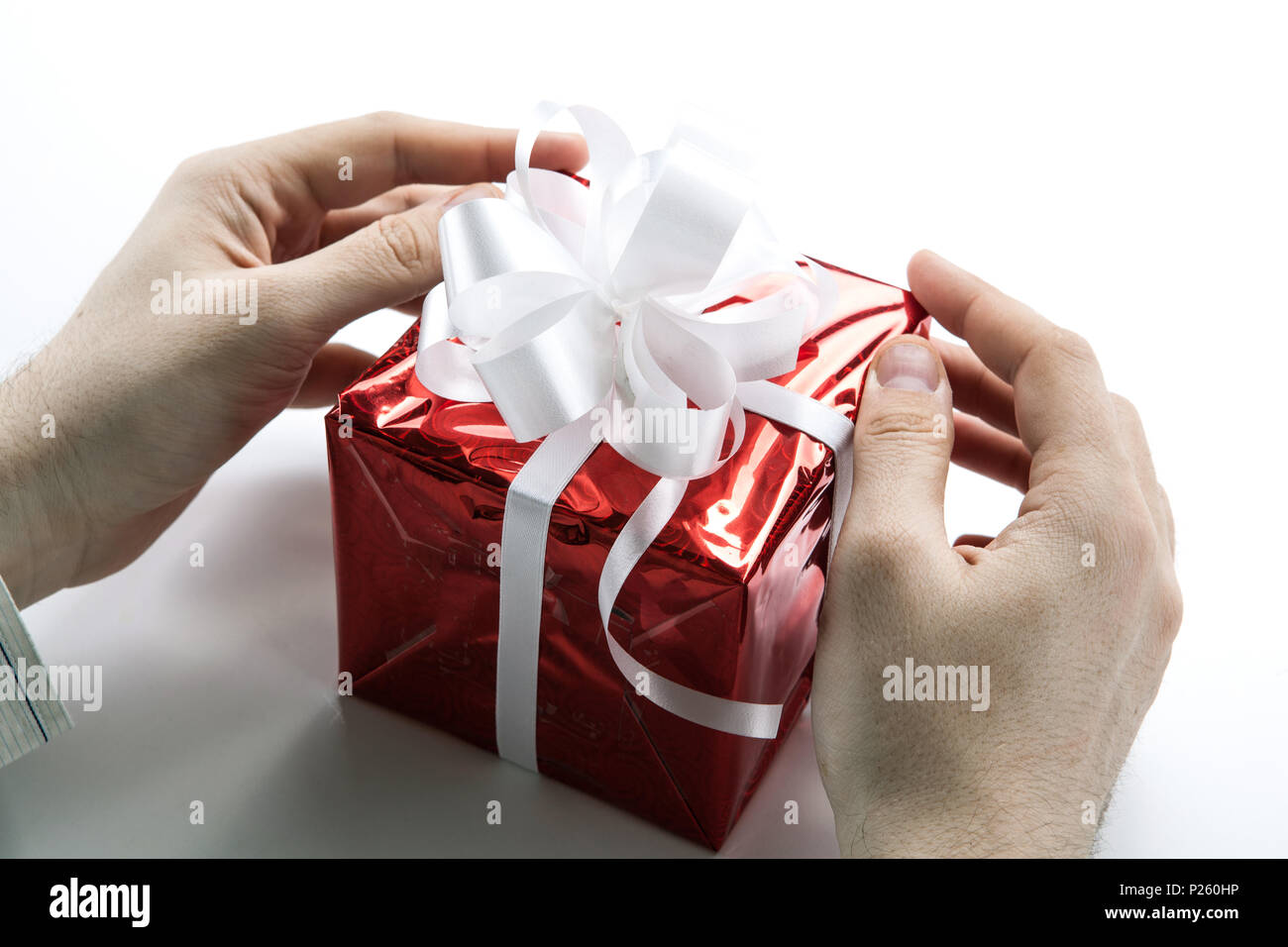 Mans hands give gift hi-res stock photography and images - Alamy