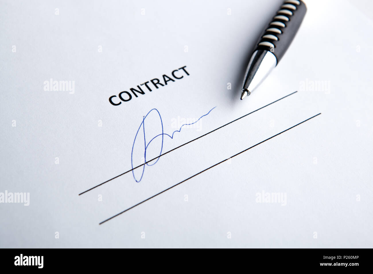 One contract with a place for a signature and a pen closeup Stock Photo ...