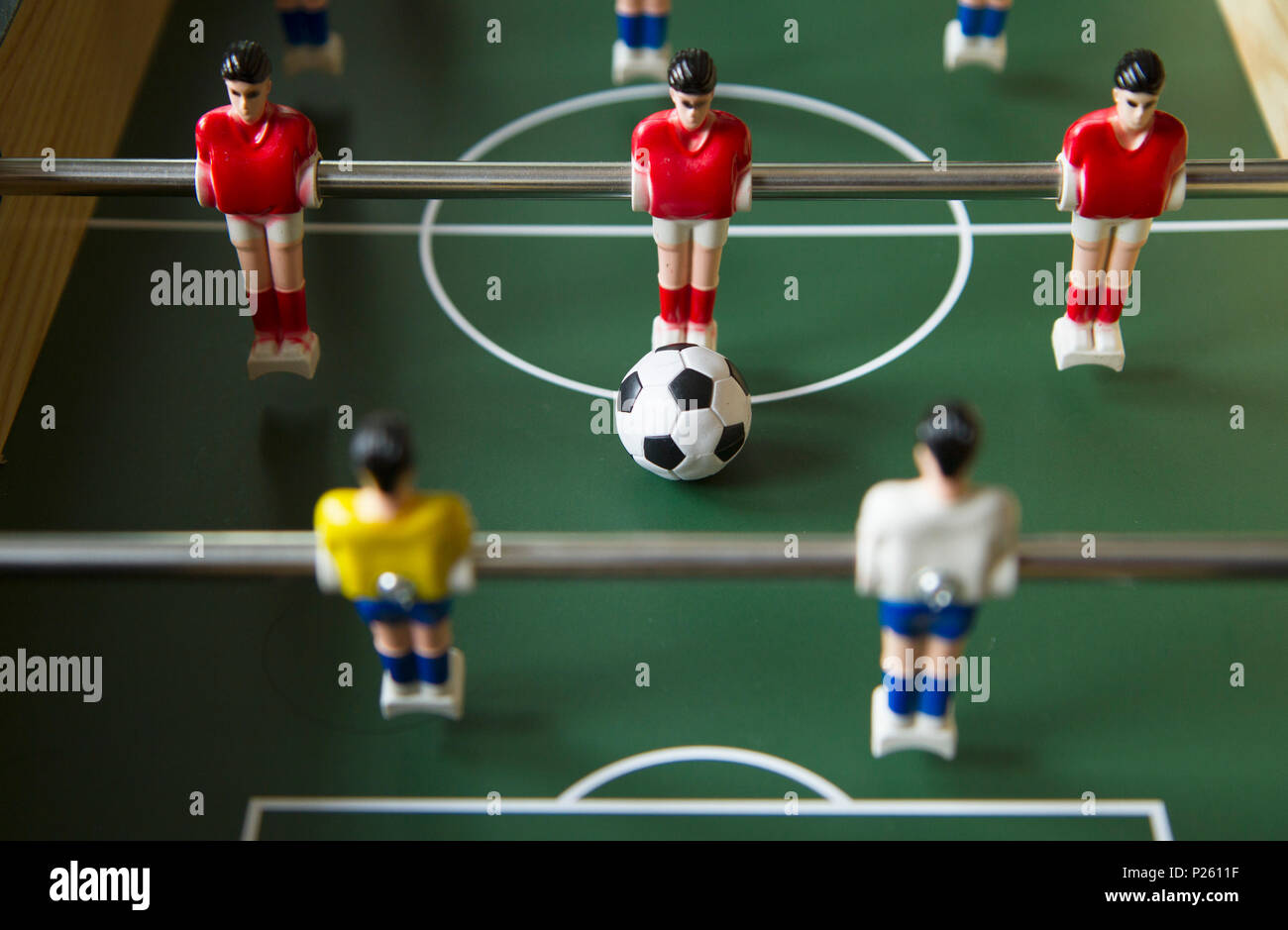 Close up image of table socker game and players Stock Photo - Alamy