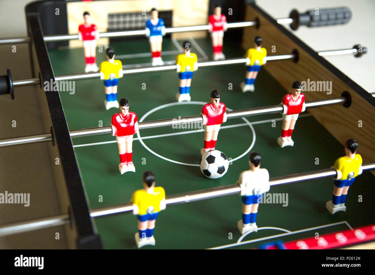 Close up image of table socker game and players Stock Photo - Alamy