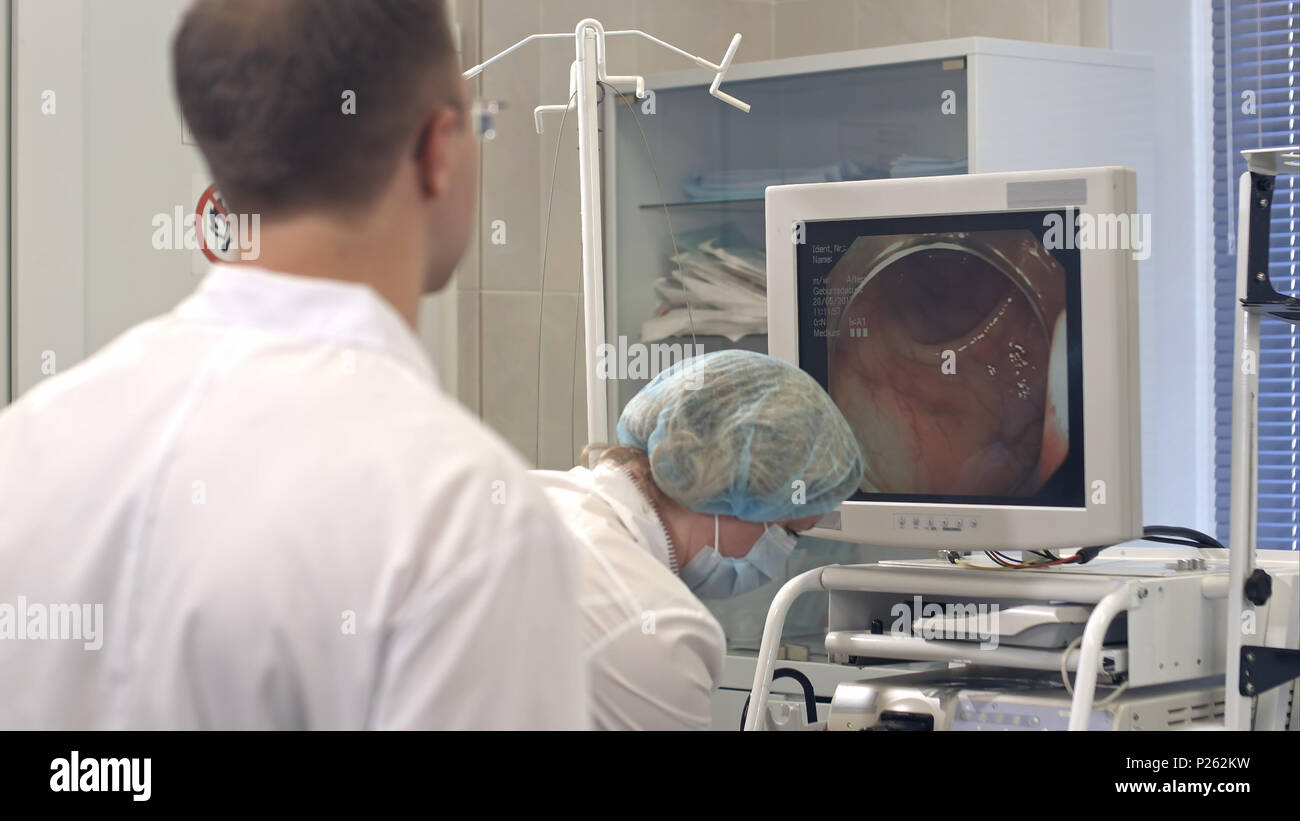 Doctor looking at the monitor during endoscopic surgery Stock Photo - Alamy