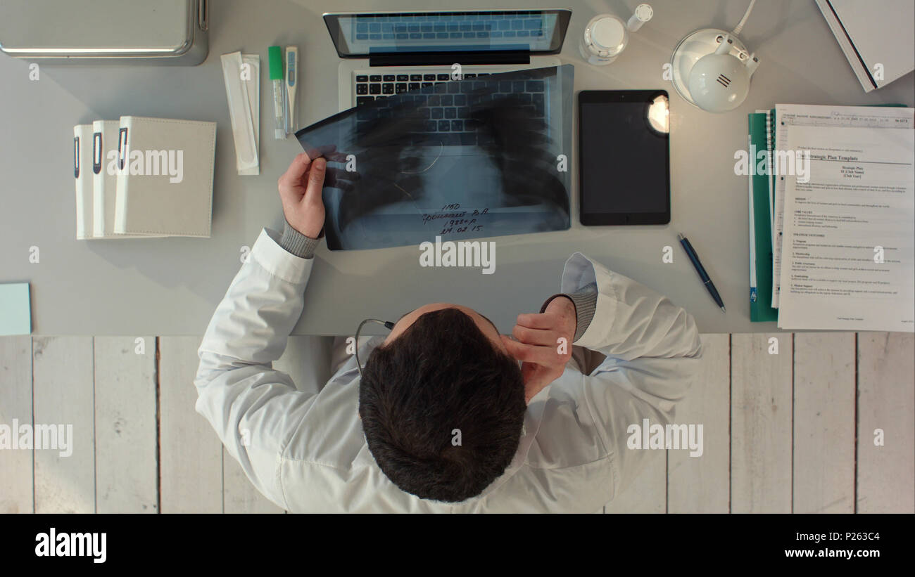 Radiologist man checking xray. Top view Stock Photo - Alamy