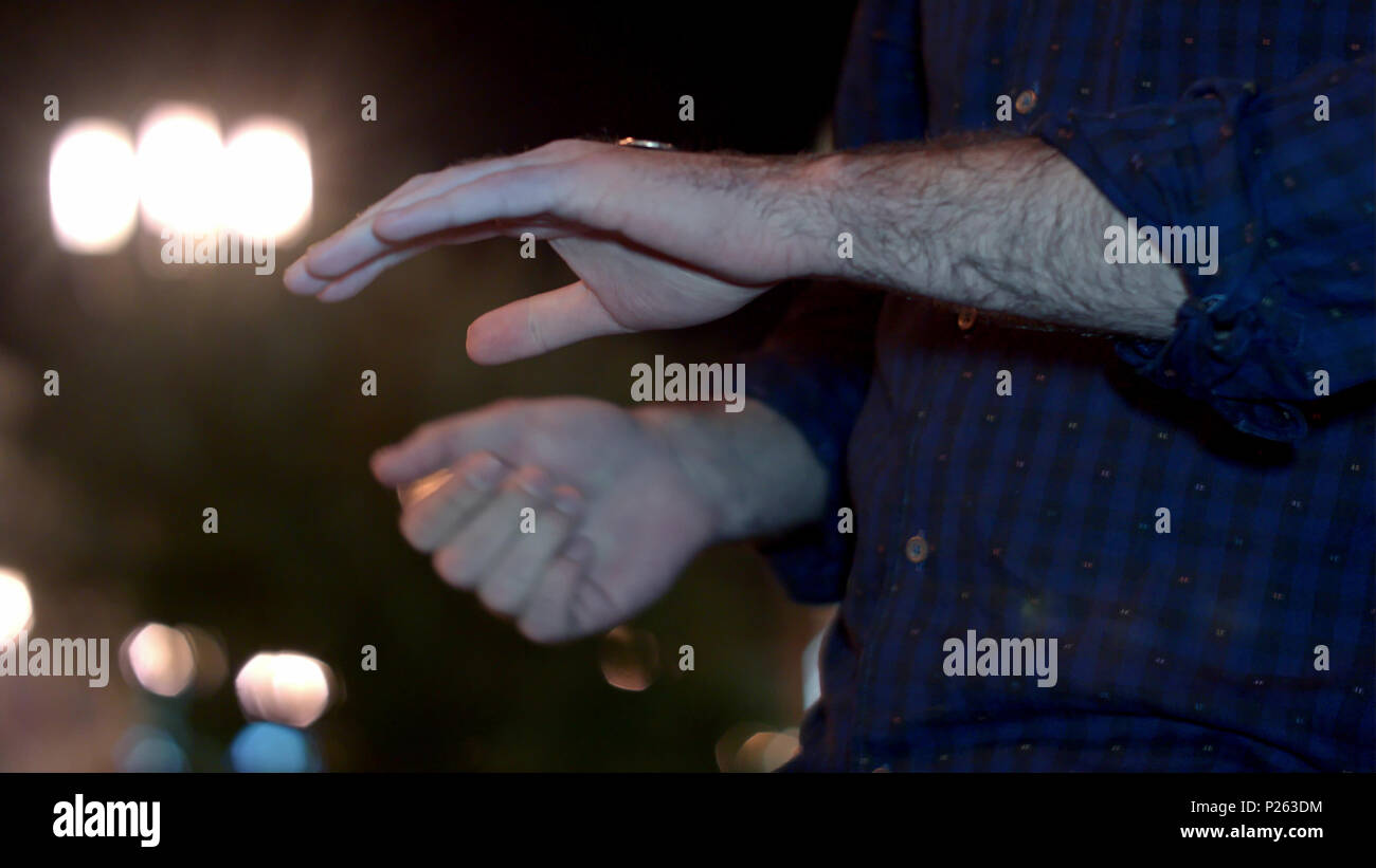 Hand ready to flip coin Stock Photo - Alamy